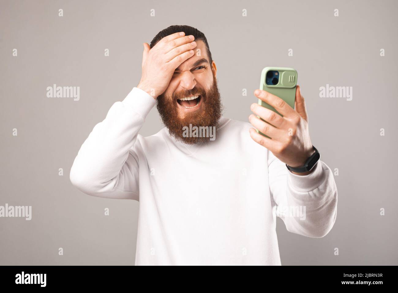 Photo of young man missed a call on smartphone Stock Photo - Alamy