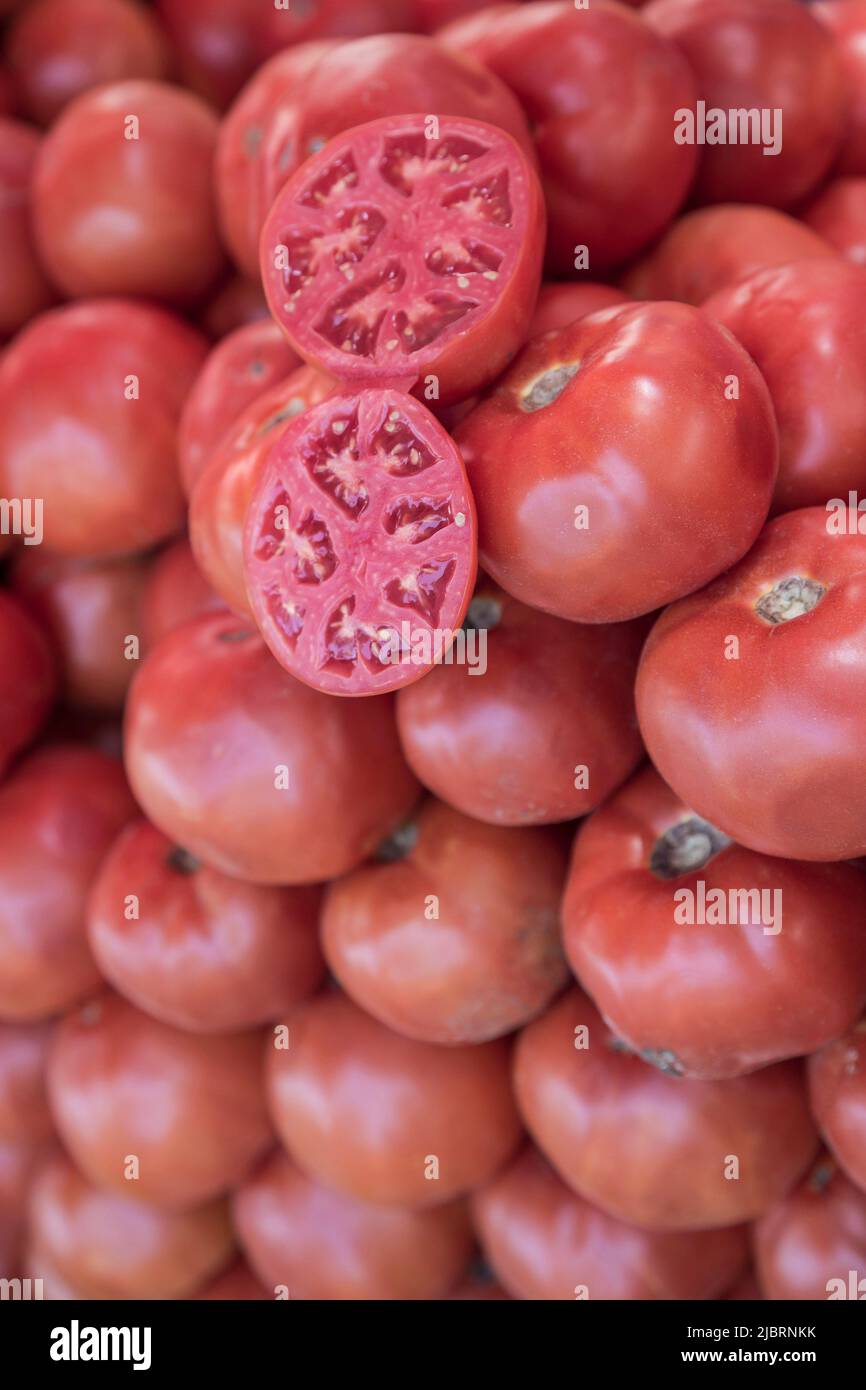 pile of ripe red tomatoes as a background Stock Photo - Alamy