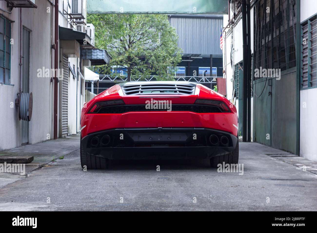Beautiful Lamborghini Huracan in Red showcased behind garage Stock ...