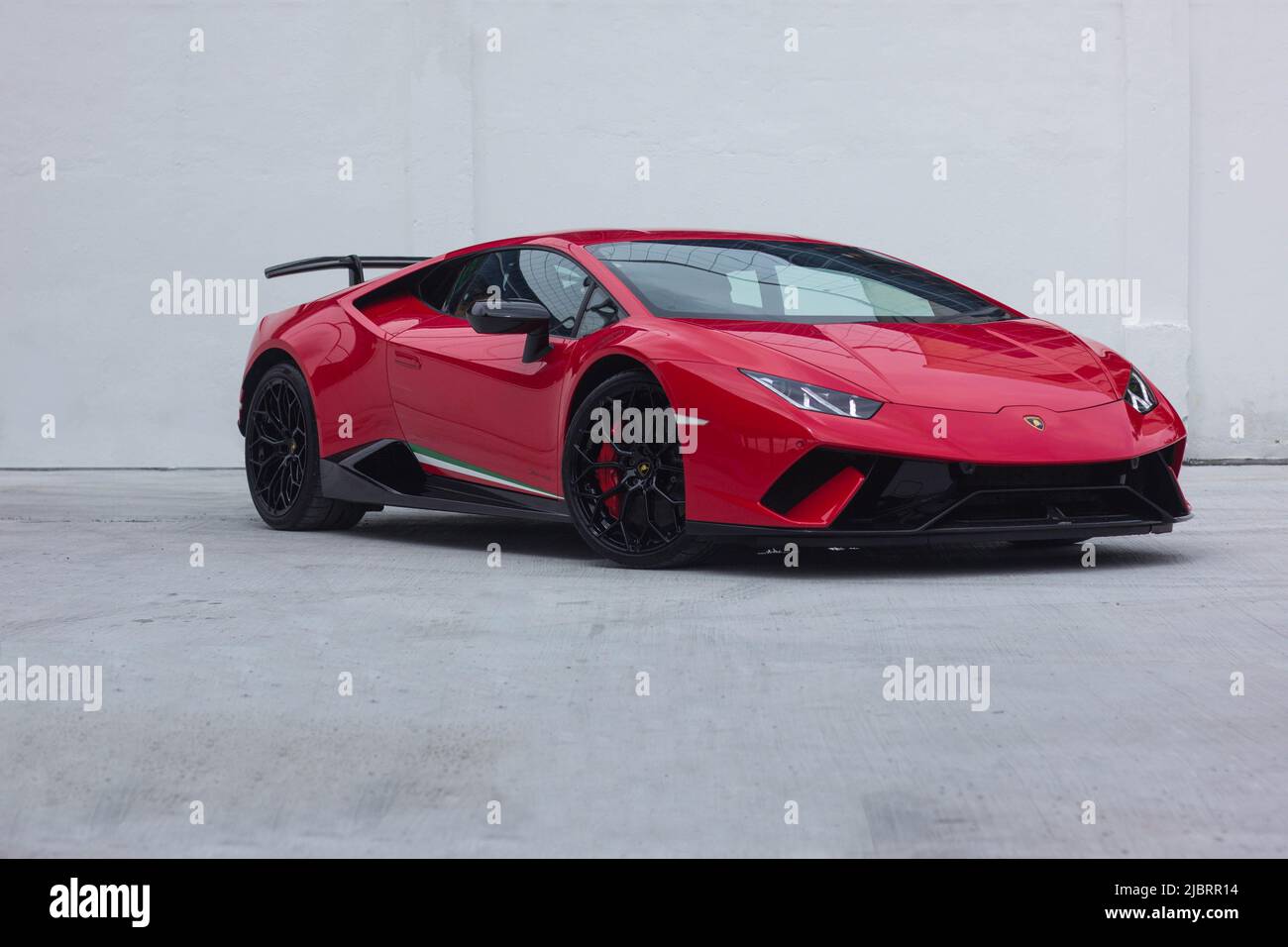 Beautiful Lamborghini Huracan in Red showcased behind garage Stock ...