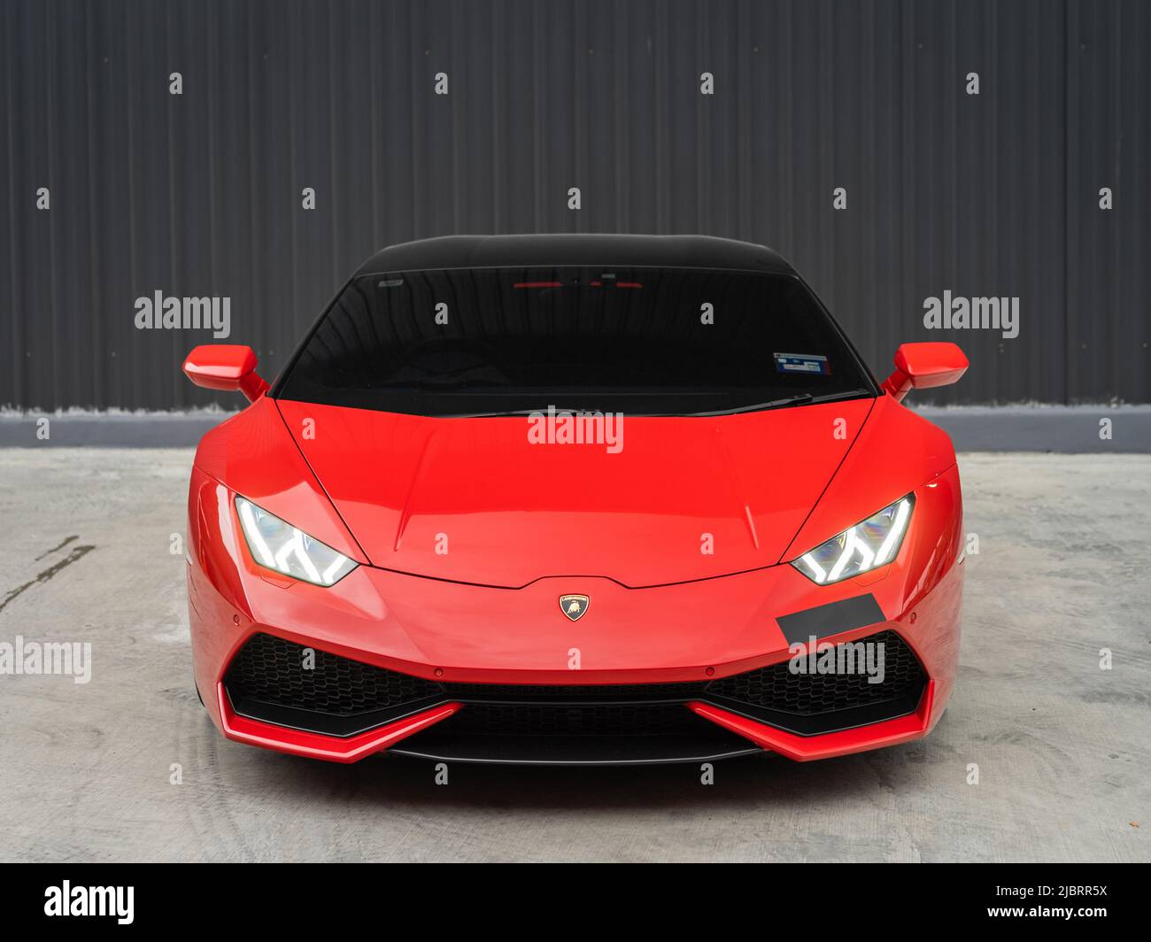 Beautiful Lamborghini Huracan in Red showcased behind garage Stock ...