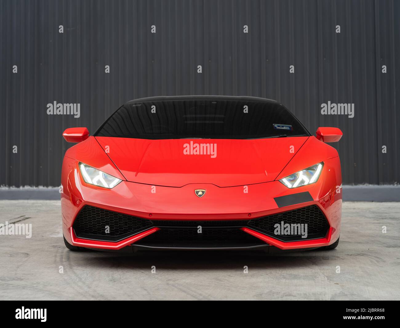 Beautiful Lamborghini Huracan in Red showcased behind garage Stock ...