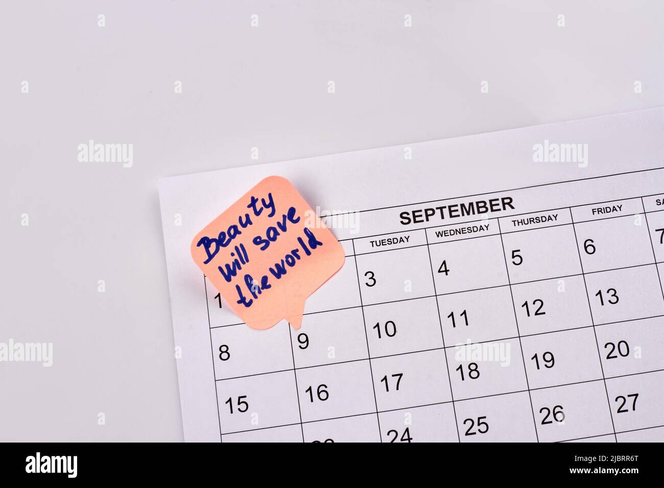 Beauty will save the world slogan on the september calendar. Isolated ...
