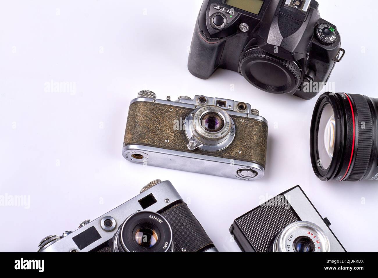 Many various different retro photo cameras on white background. Old ...