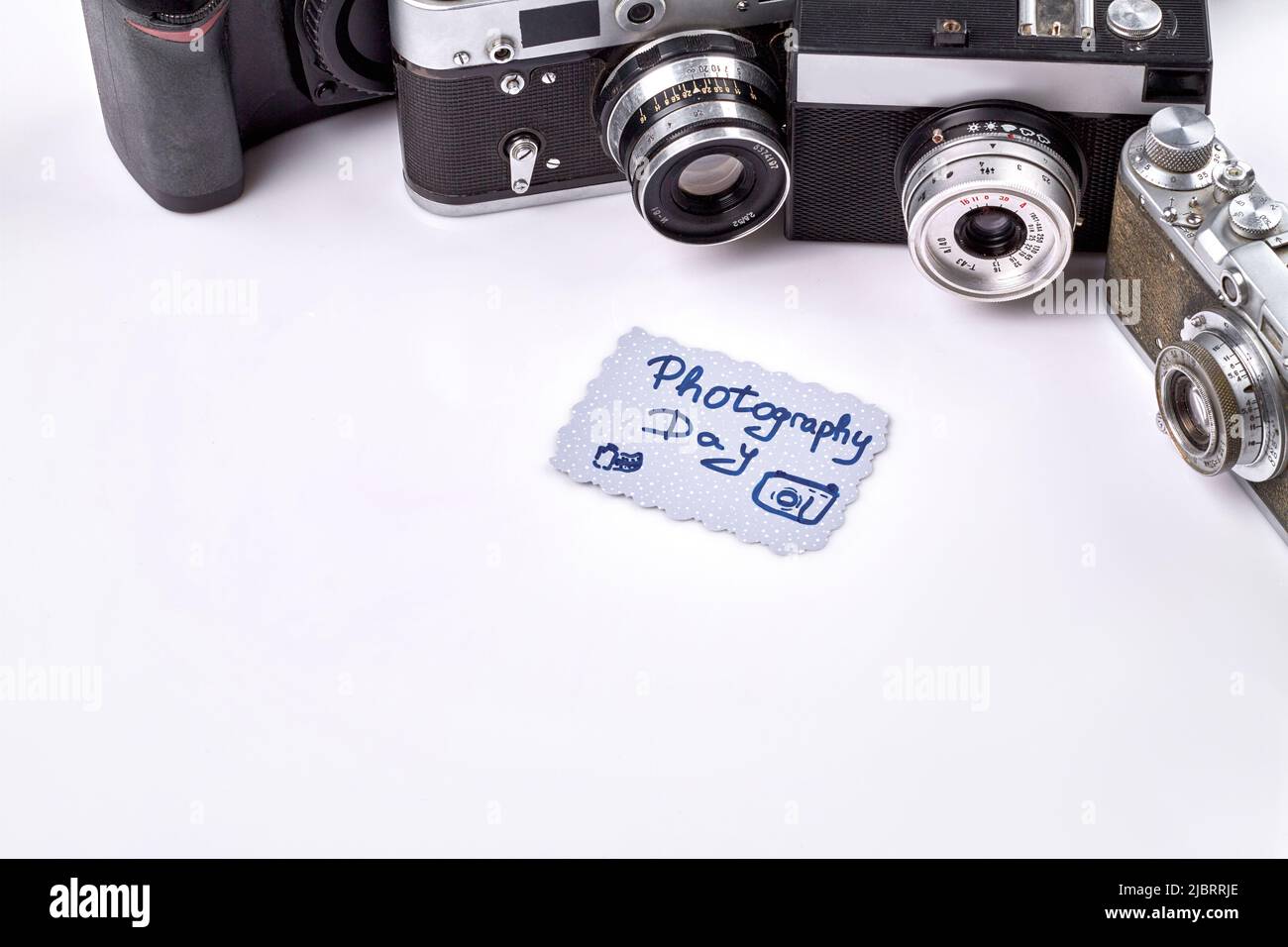 Photography day on the paper. Old retro vintage photo cameras. Isolated ...