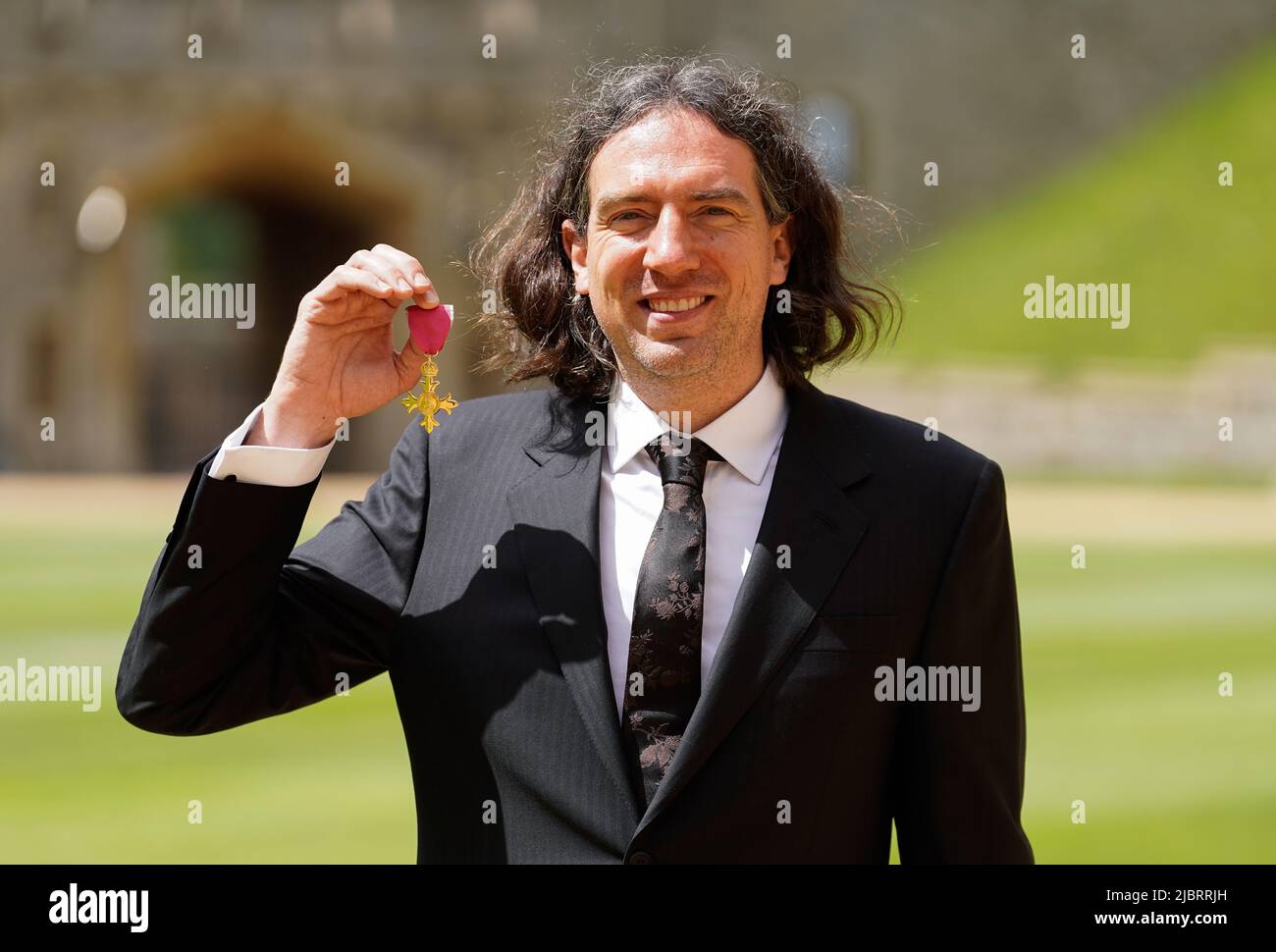 Gary Lightbody with his OBE, following an investiture ceremony at ...