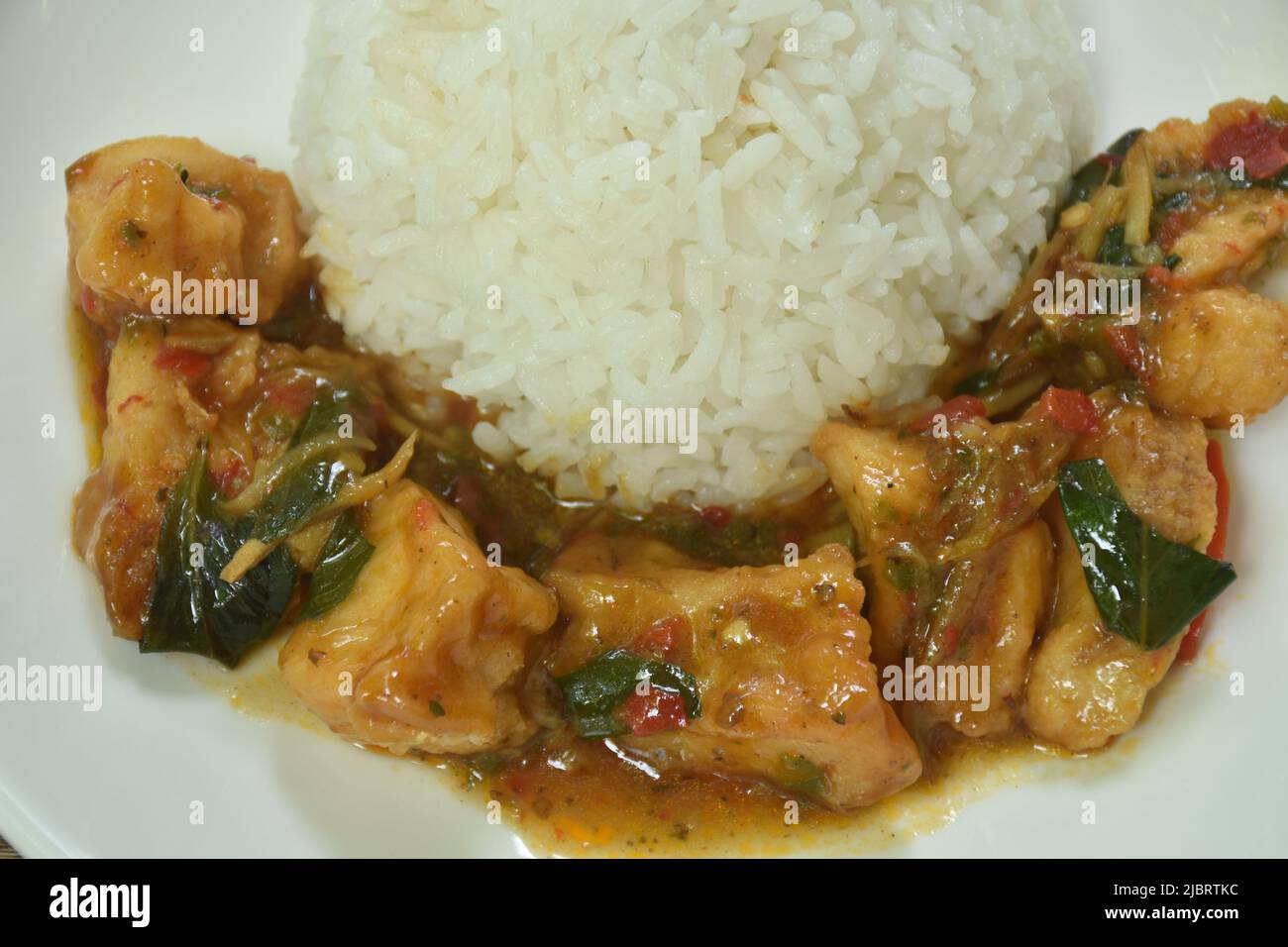 spicy stir fried bass fish with white finger root and chili with rice ...