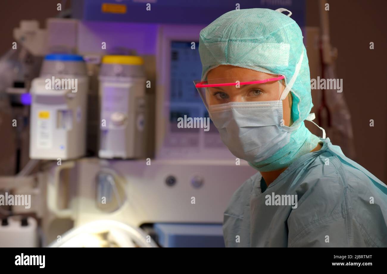 A young woman is seen in a surgical operation theater. She is correctly ...