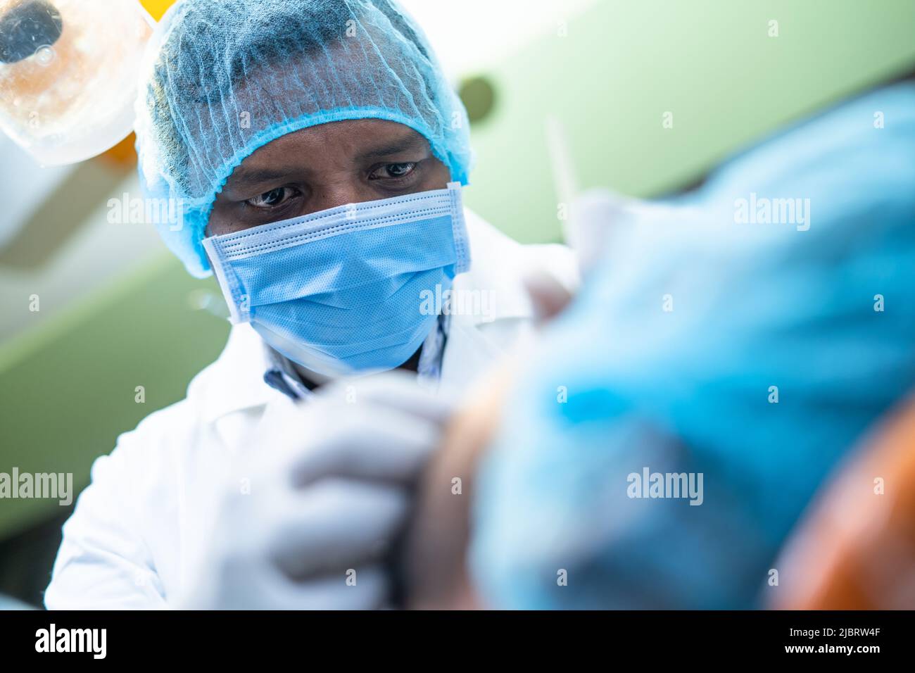 Close up of dentist busy operating surgery at hospital - concept of ...