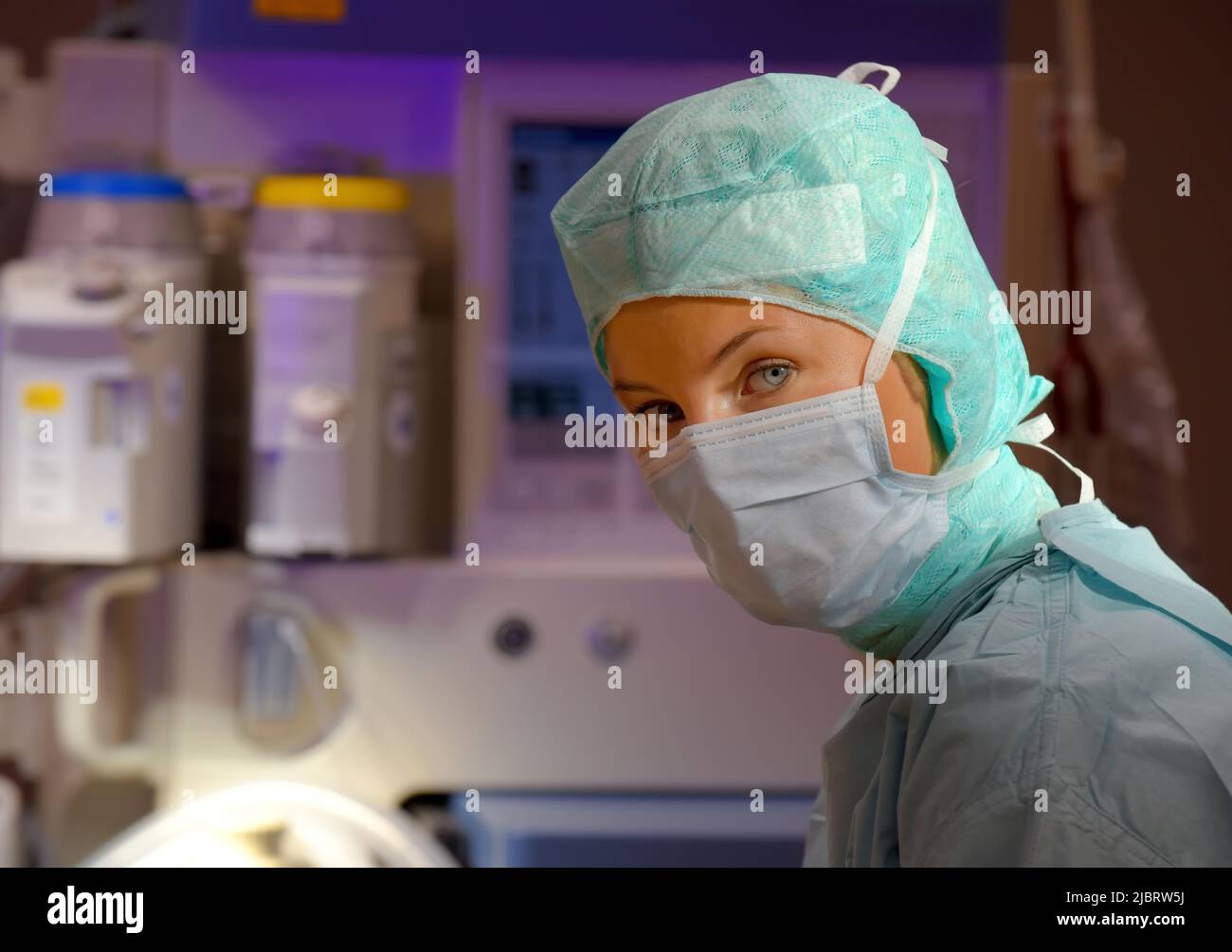 A woman is seen in a hospital operation theater. She is fully dressed ...
