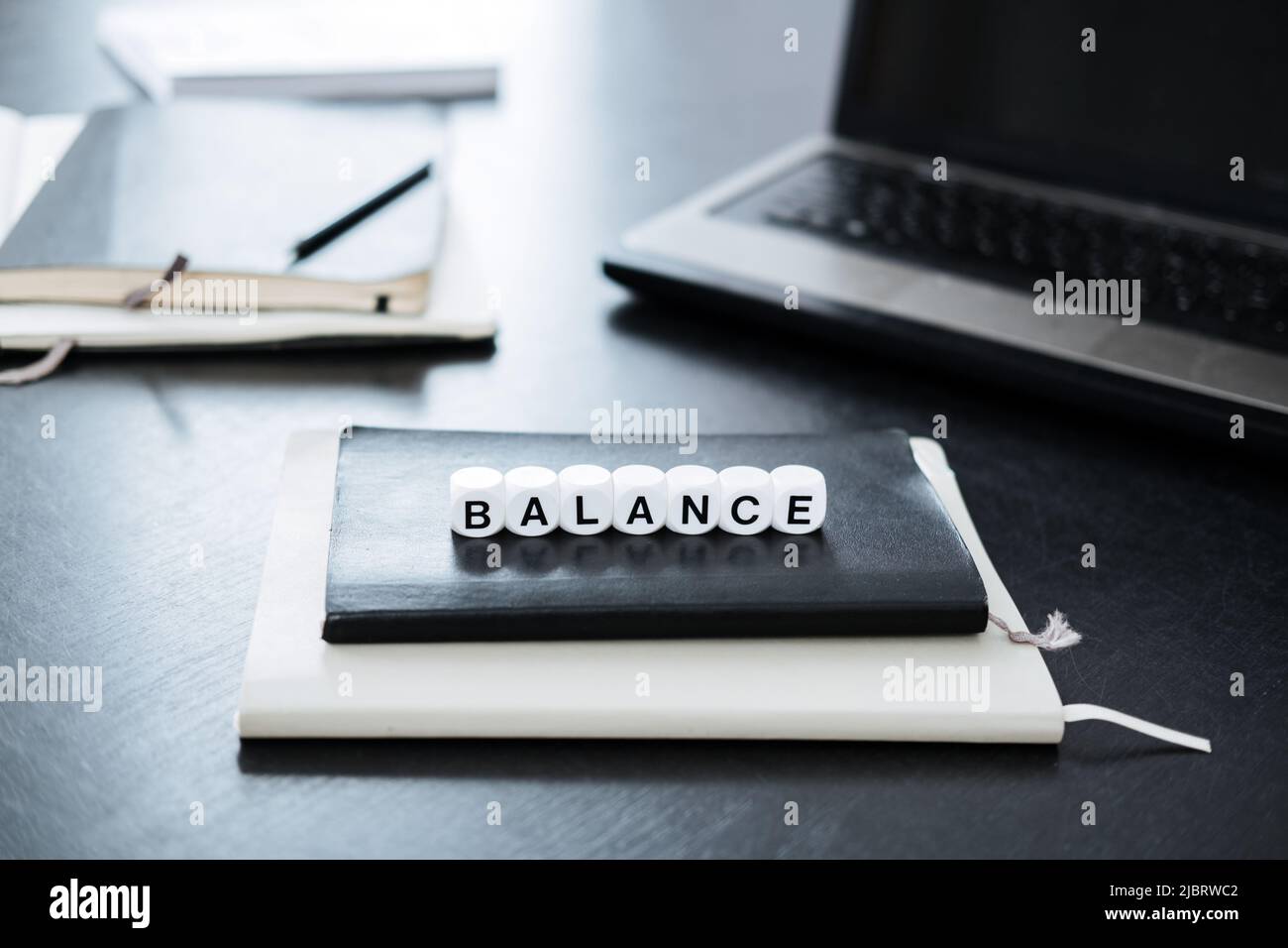 Balance in Accounting. Word Balance on background of laptop and ...