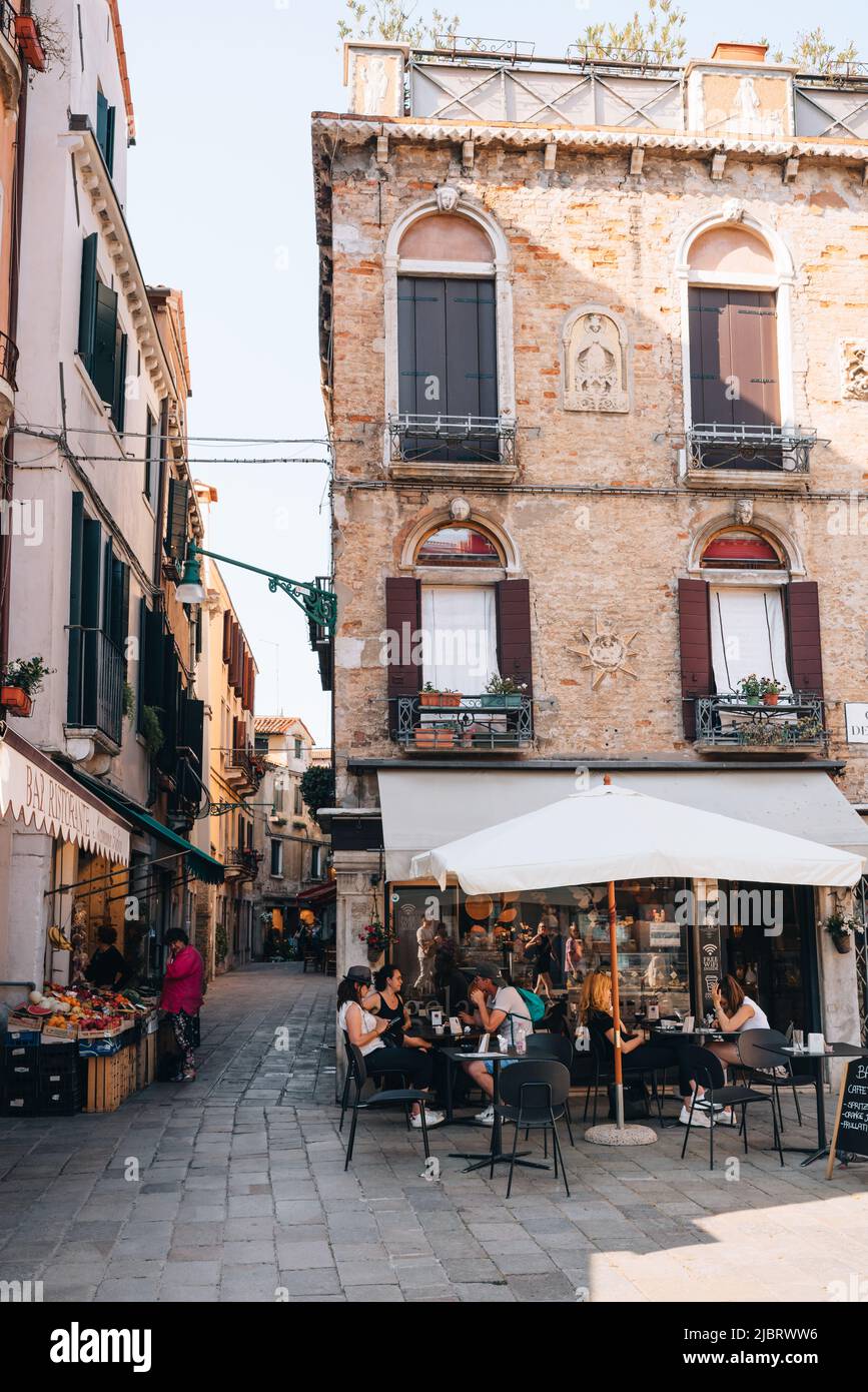 Venice, Italy - May 21, 2022: People at the outdoor tables of a ...