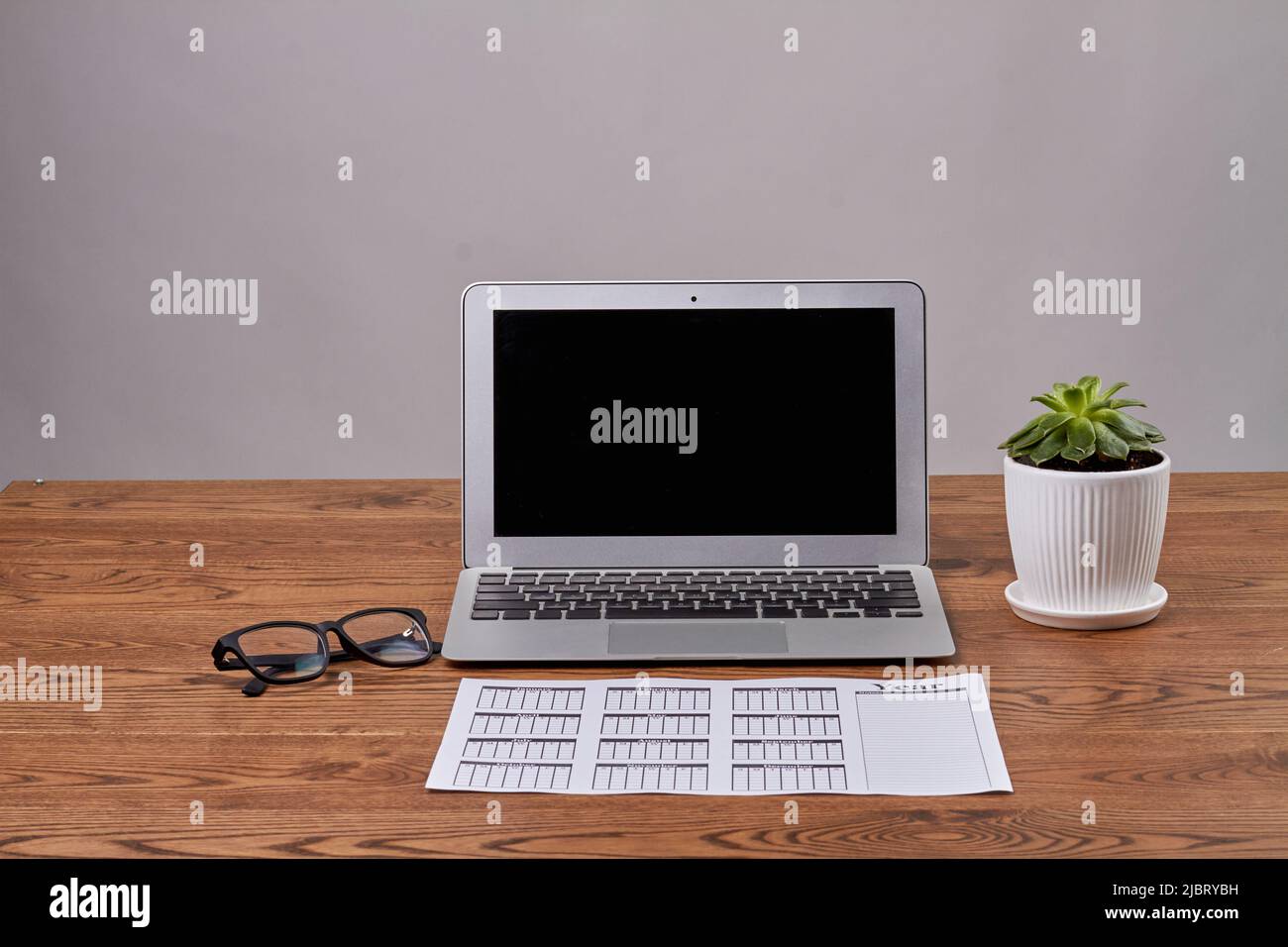Business image of schedule book with glasses and laptop computer. Black ...