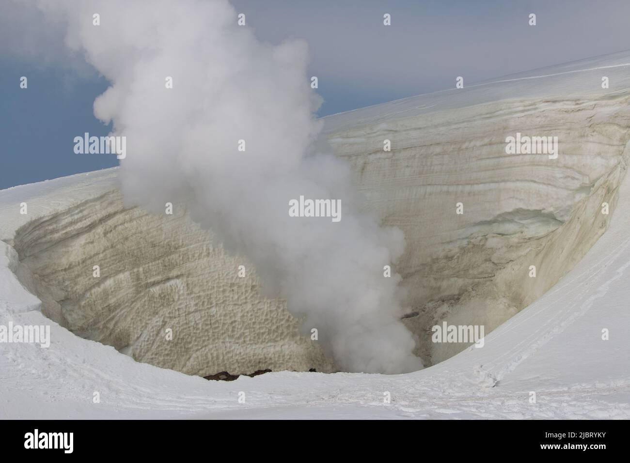 Steam rising from a volcano fumarole surrounded by snow Stock Photo - Alamy