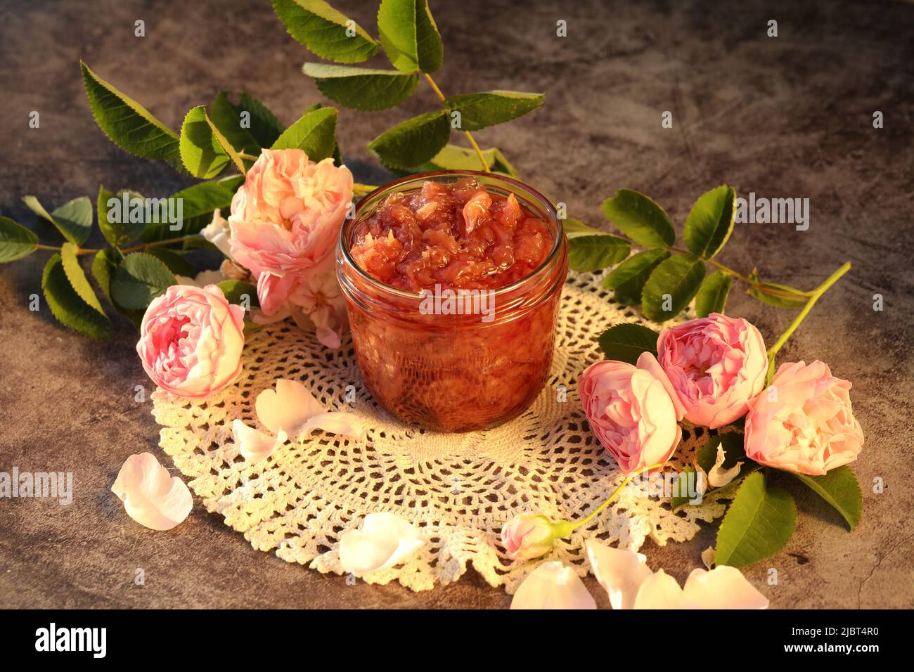 Rose petal jam with pink roses. still life Stock Photo - Alamy