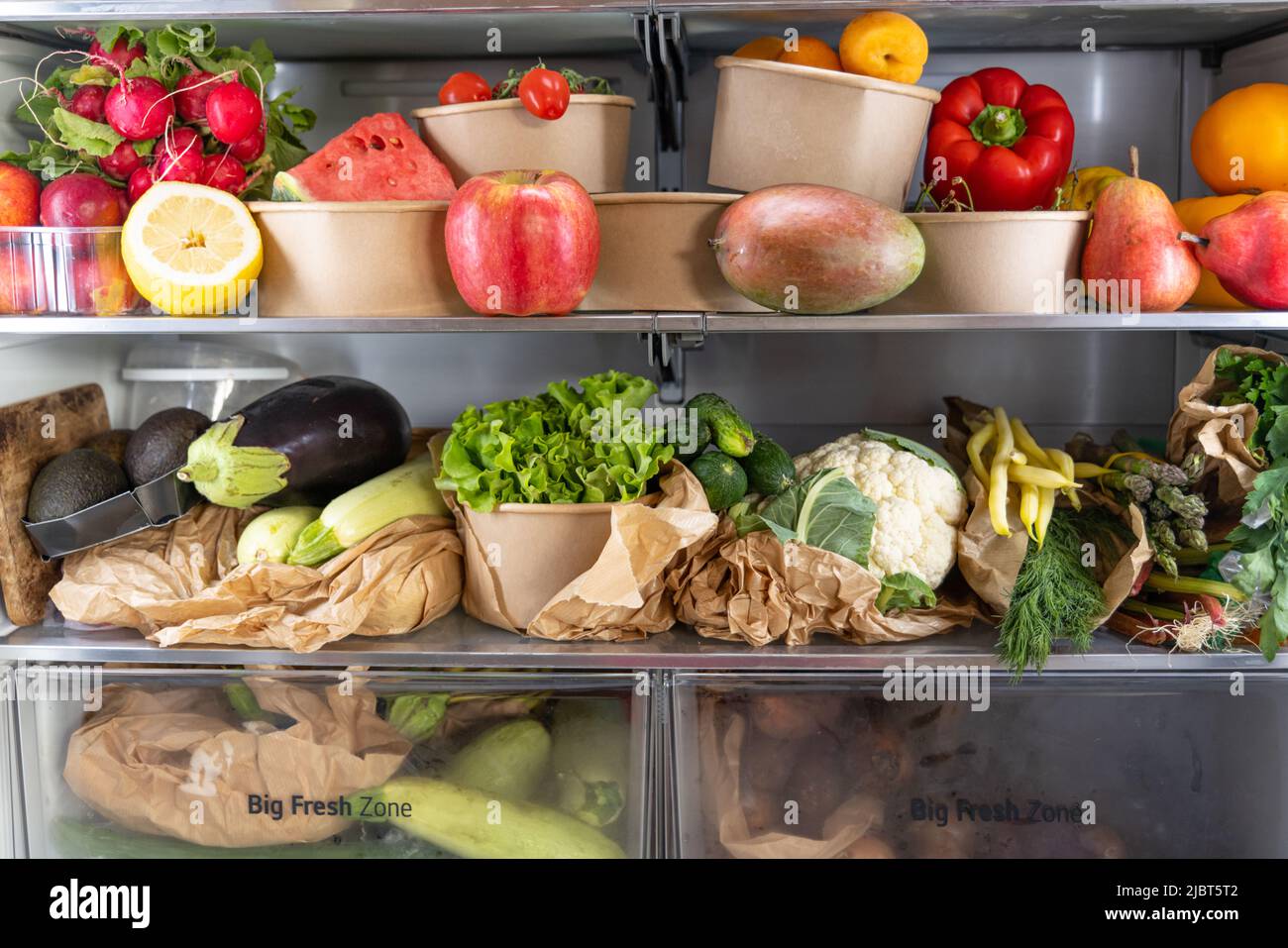 Opened refrigerator full of vegetarian healthy fresh fruit, vegetables ...