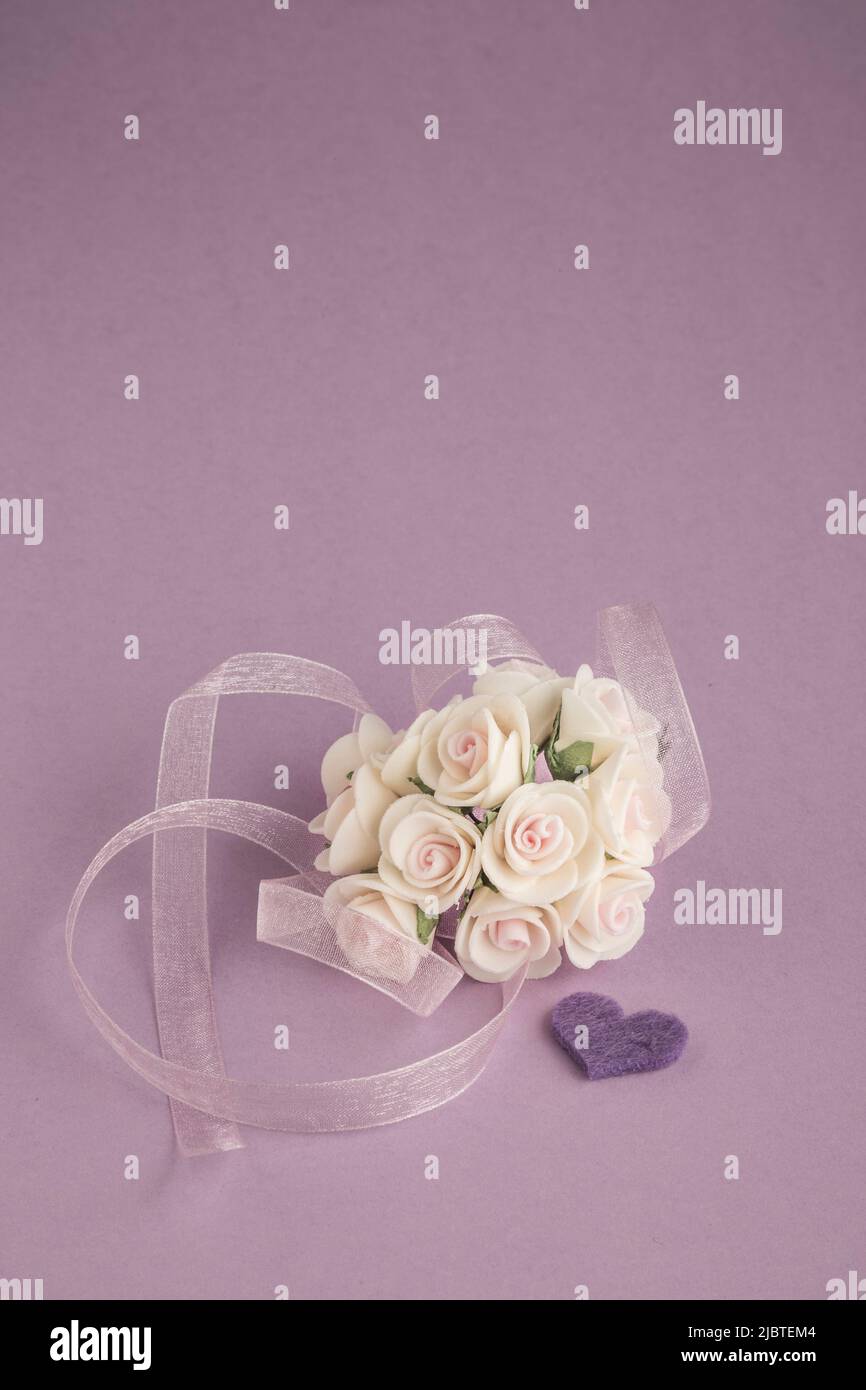 rose and ribbon on purple background with copy space Stock Photo - Alamy