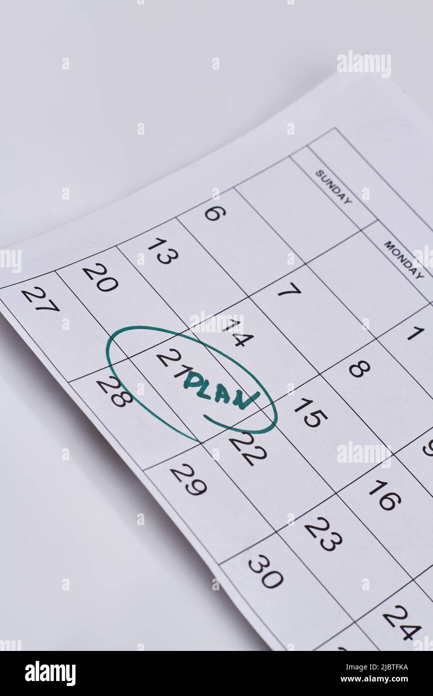Vertical shot plan day marked in the calendar on white background. Top ...