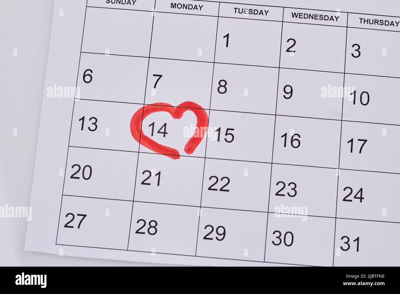 14 february day marked in calendar by red marker in the heart shape ...