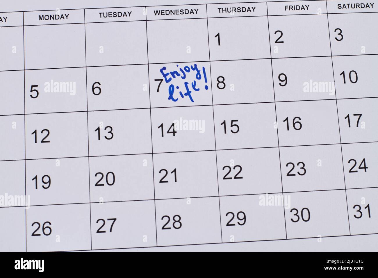 Paper month calendar with enjoy life handwriting. Top view flat lay ...