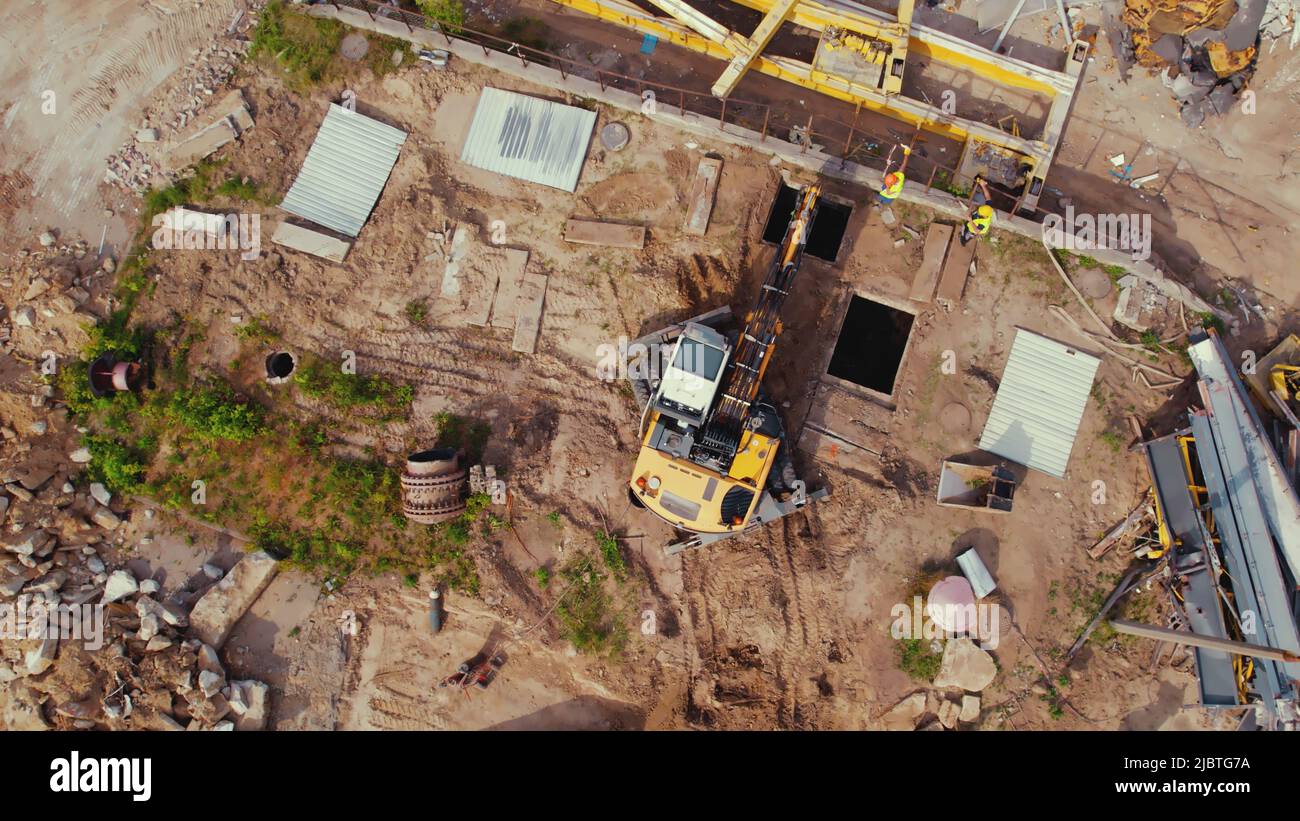 06.08.2022 - Warsaw, Poland - Top down view of the excavator working on ...