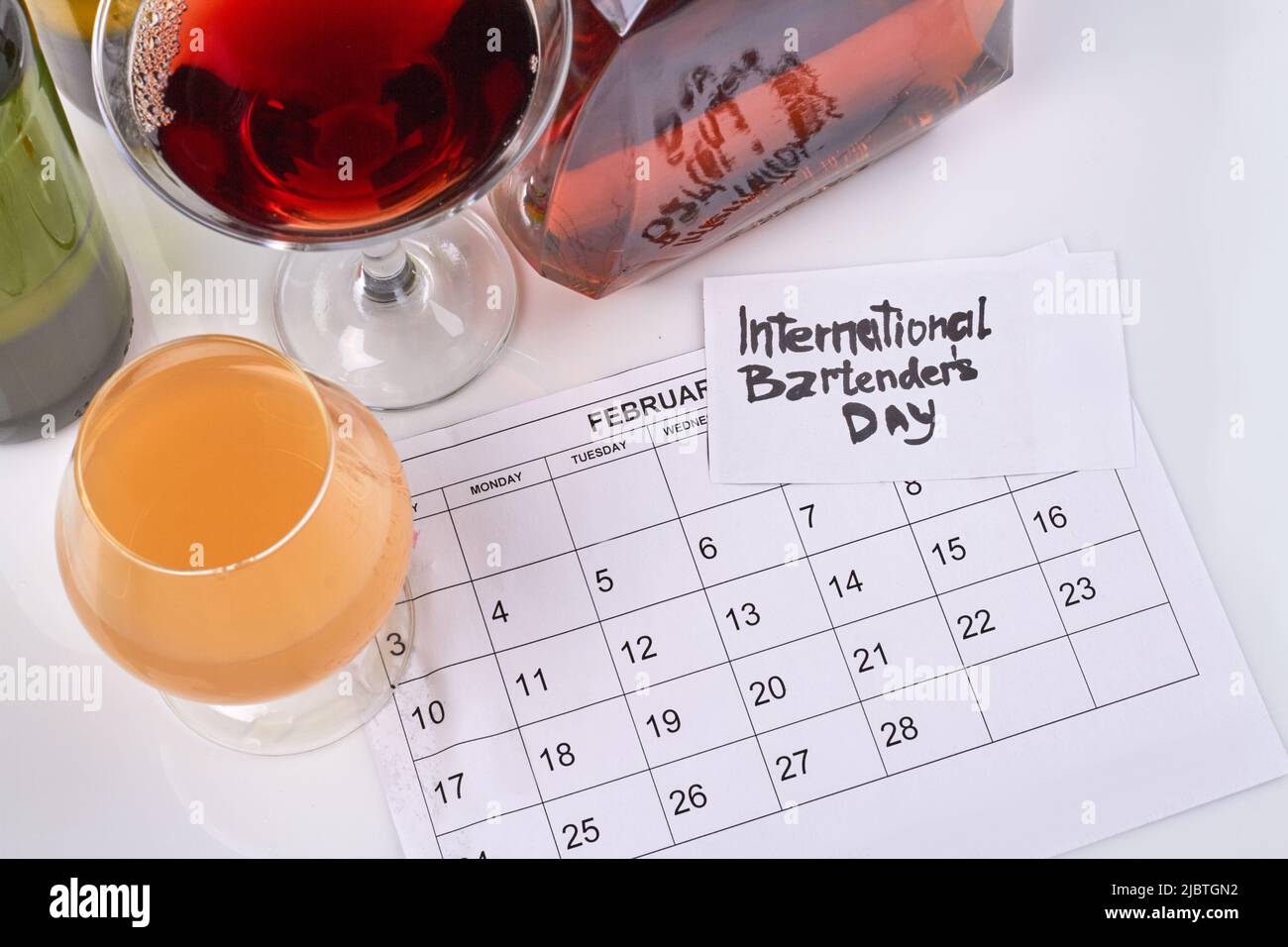 Top view glasses with alco drings and february calendar. International ...