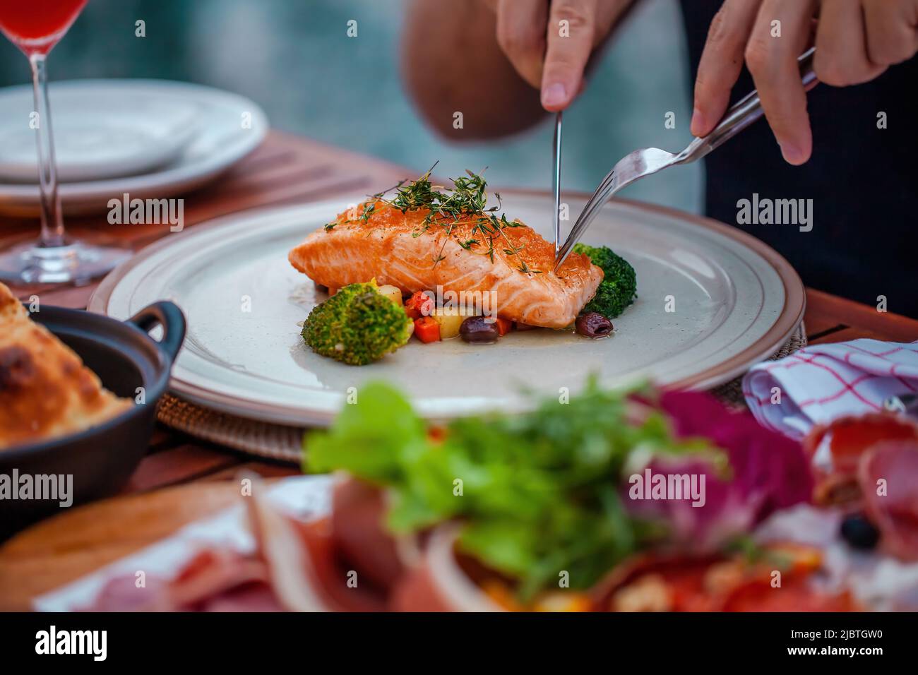 Man on luxury dinner served on table with fresh seafood in luxury ...