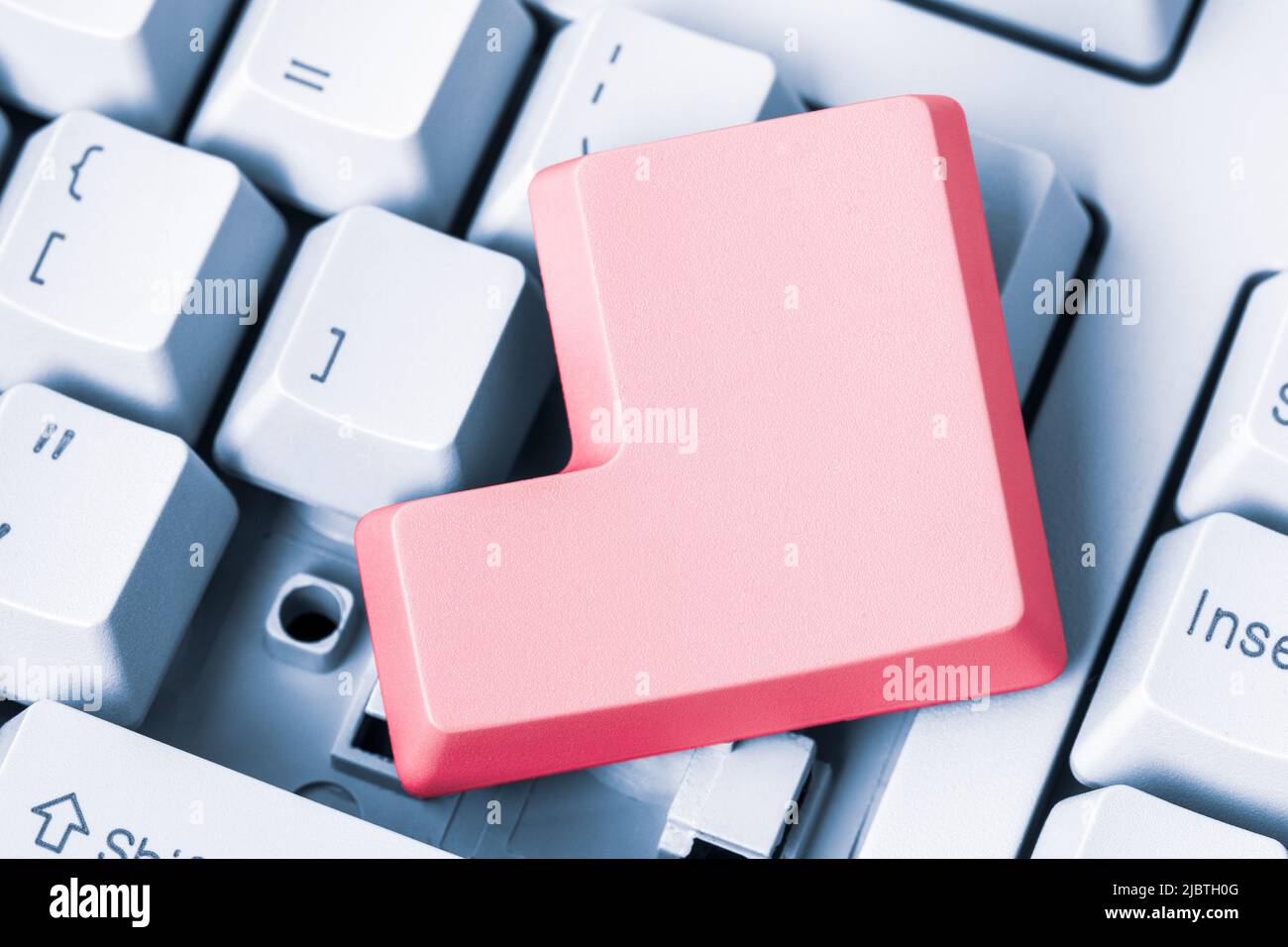 Empty red button removed from computer keyboard. Computer technology ...