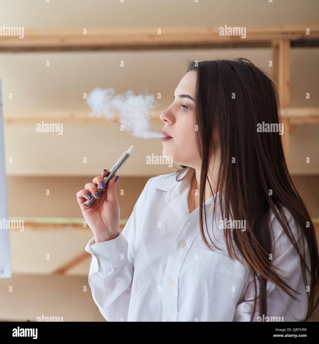 Happy vaper girl with vaping device in hand.Quit smoking nicotine ...