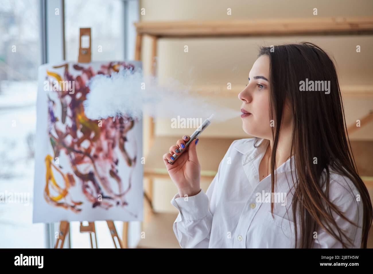 Modern girl smoking vape.Trendy new vaping device,smoke e-liquid ...