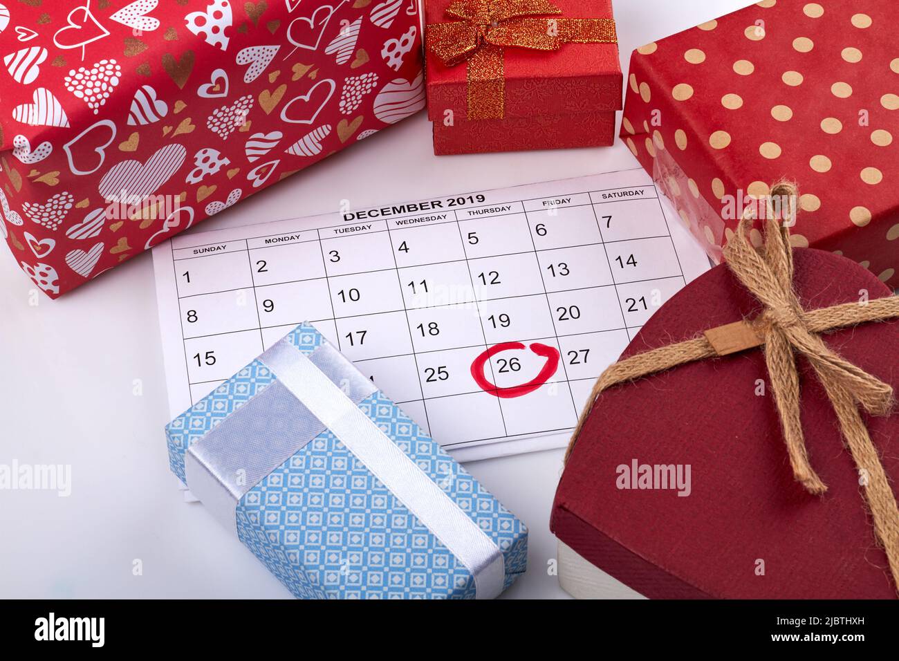 Boxing day concept. Red gift boxes and december calendar with mark on ...