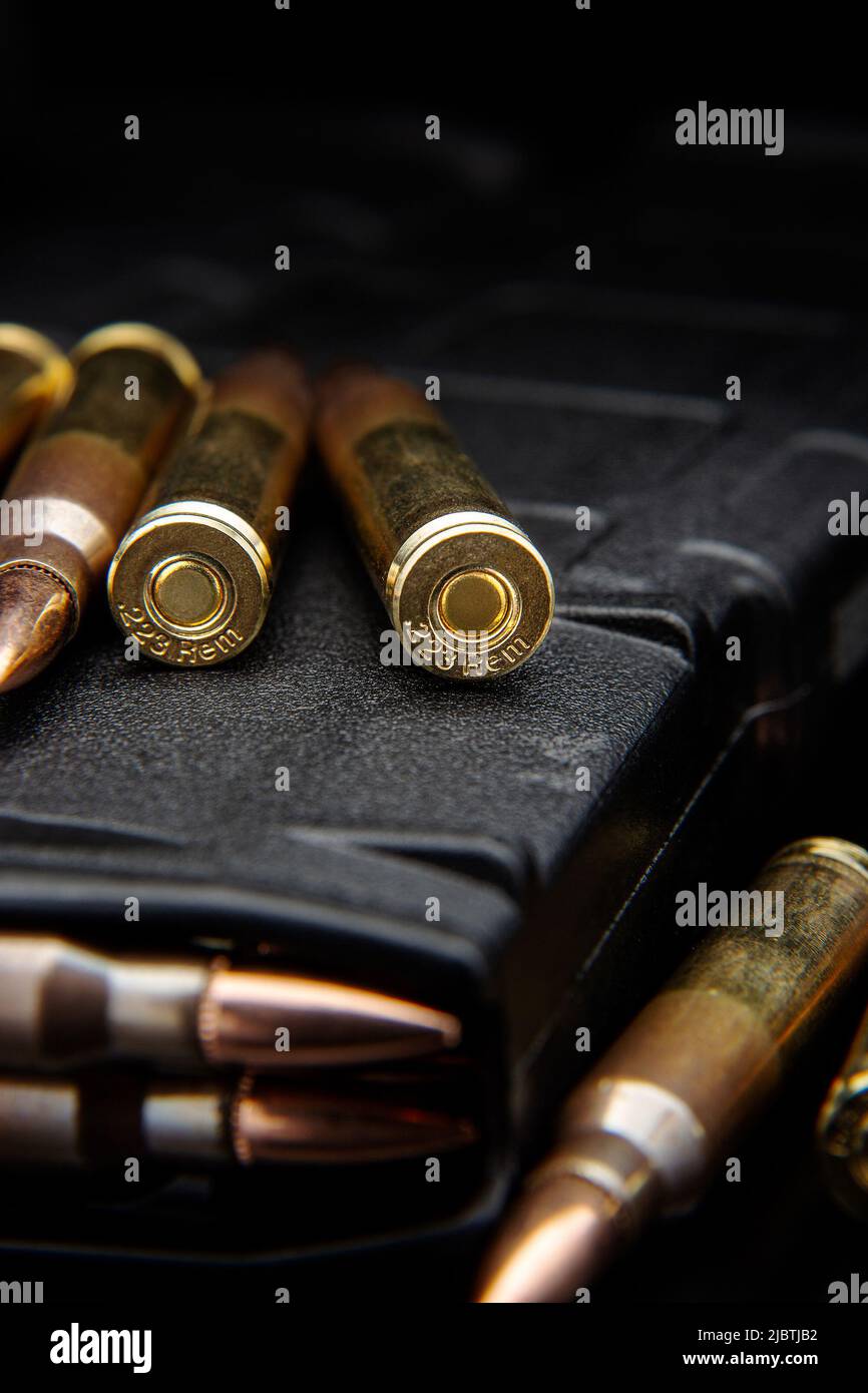 Bullet isolated on black background with reflexion. Rifle bullets close ...