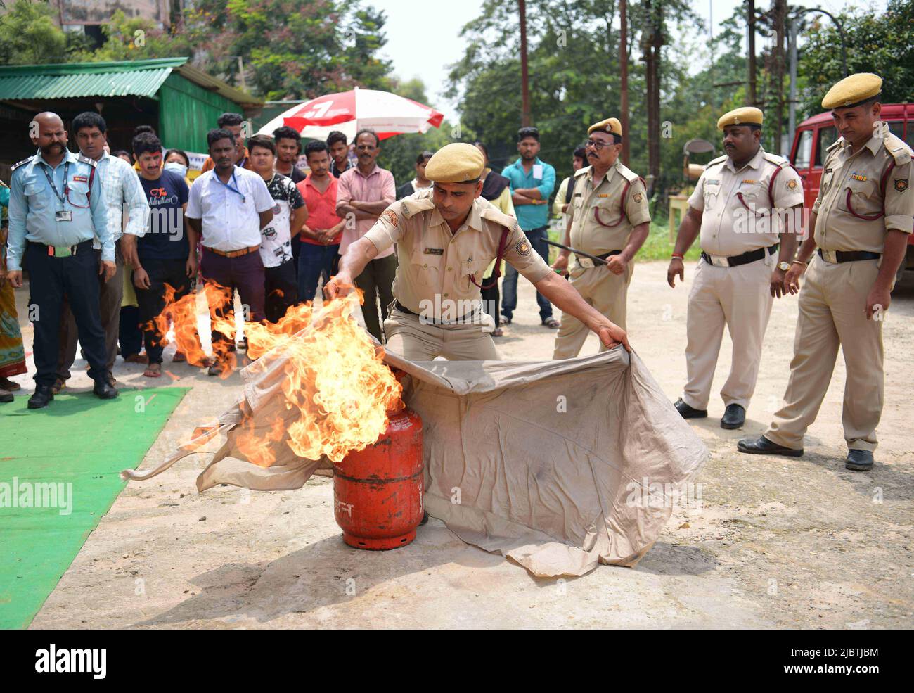 Agartala, India's northeastern state of Tripura. 8th June, 2022. A firefighter shows how to ...