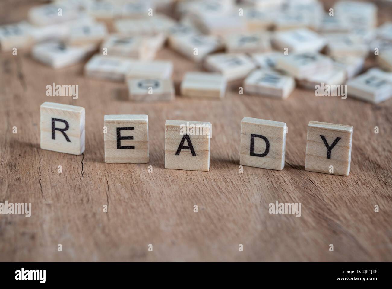 the word ready written with cube letters on wooden background Stock ...