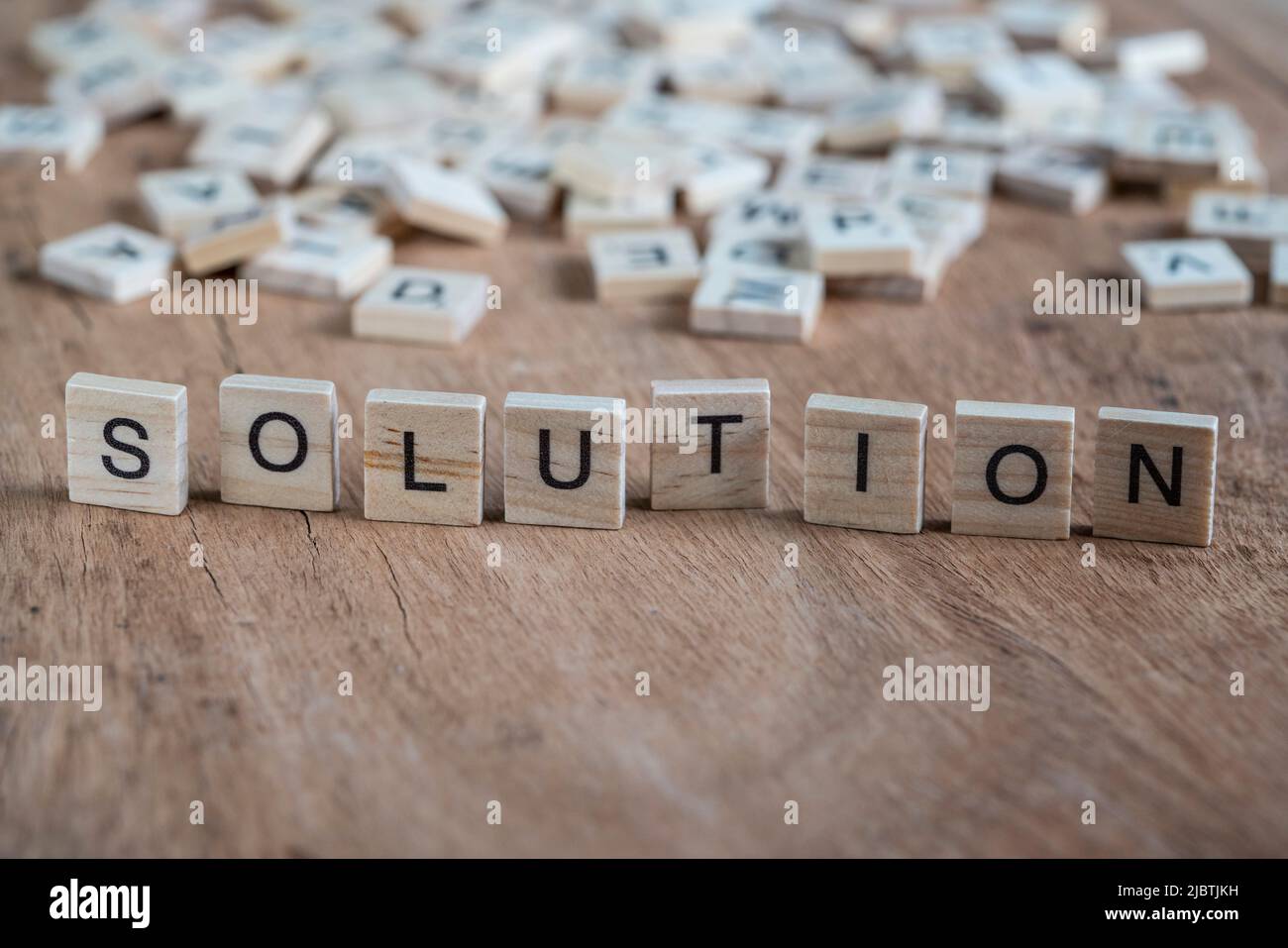 the word solution written with cube letters on wooden background Stock ...