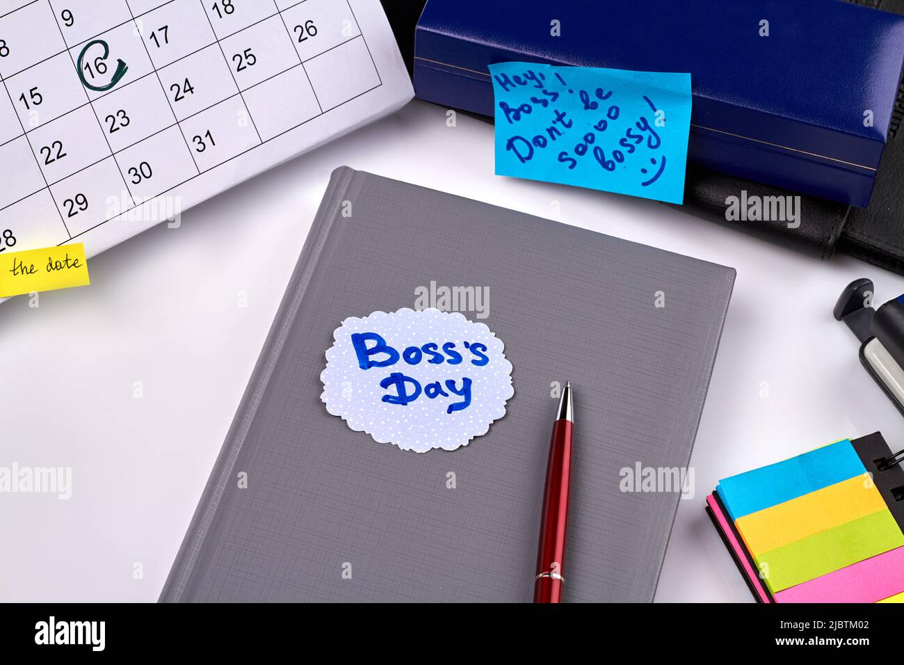 Top view word desk of a boss. Boss day concept. Book with pen and ...