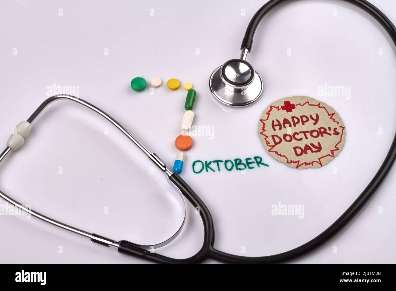 Happy doctors day concept. Stethoscope and tablet pills. Medical ...