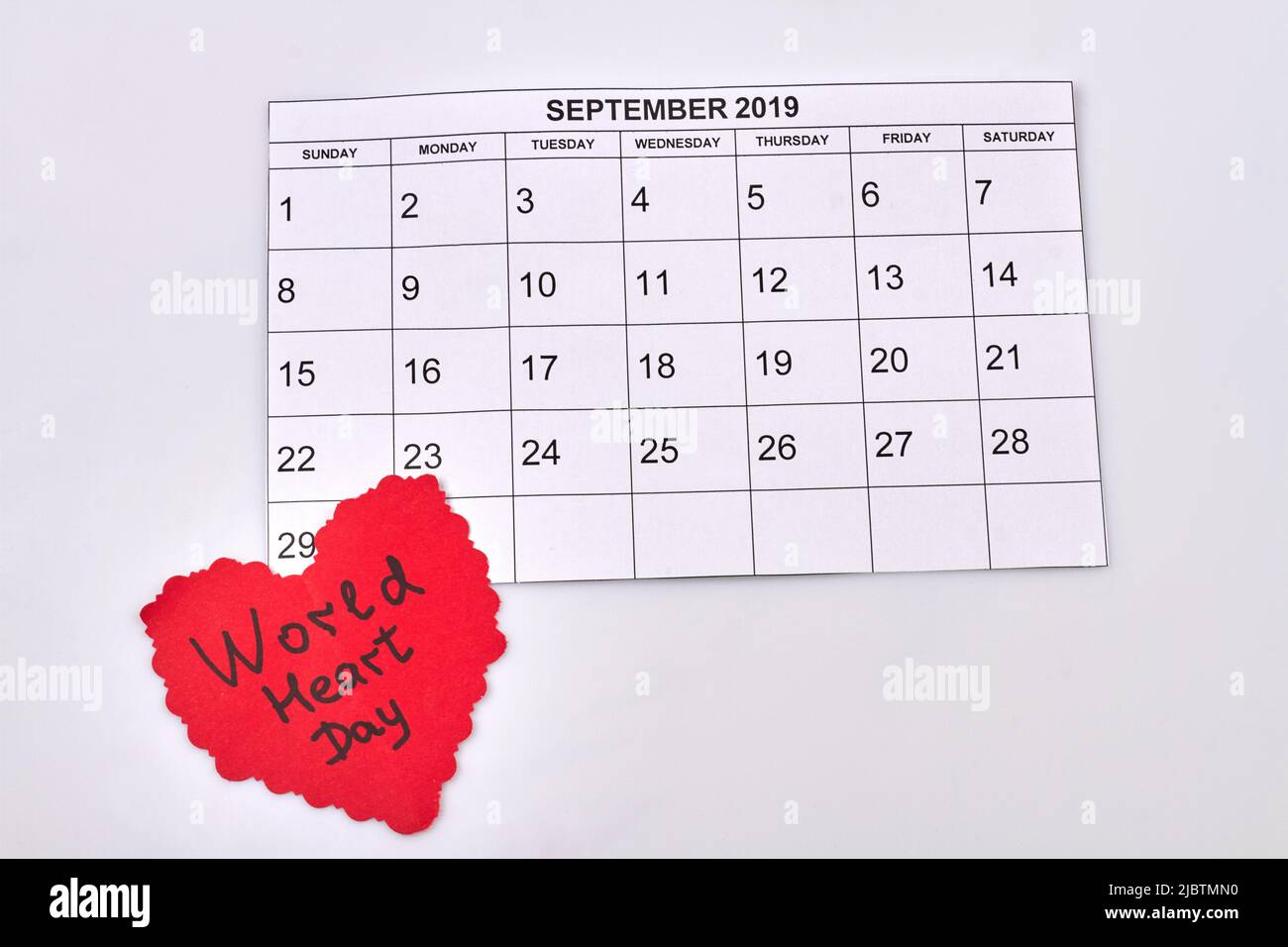 World heart day concept. Red card in the shape of heart. September ...