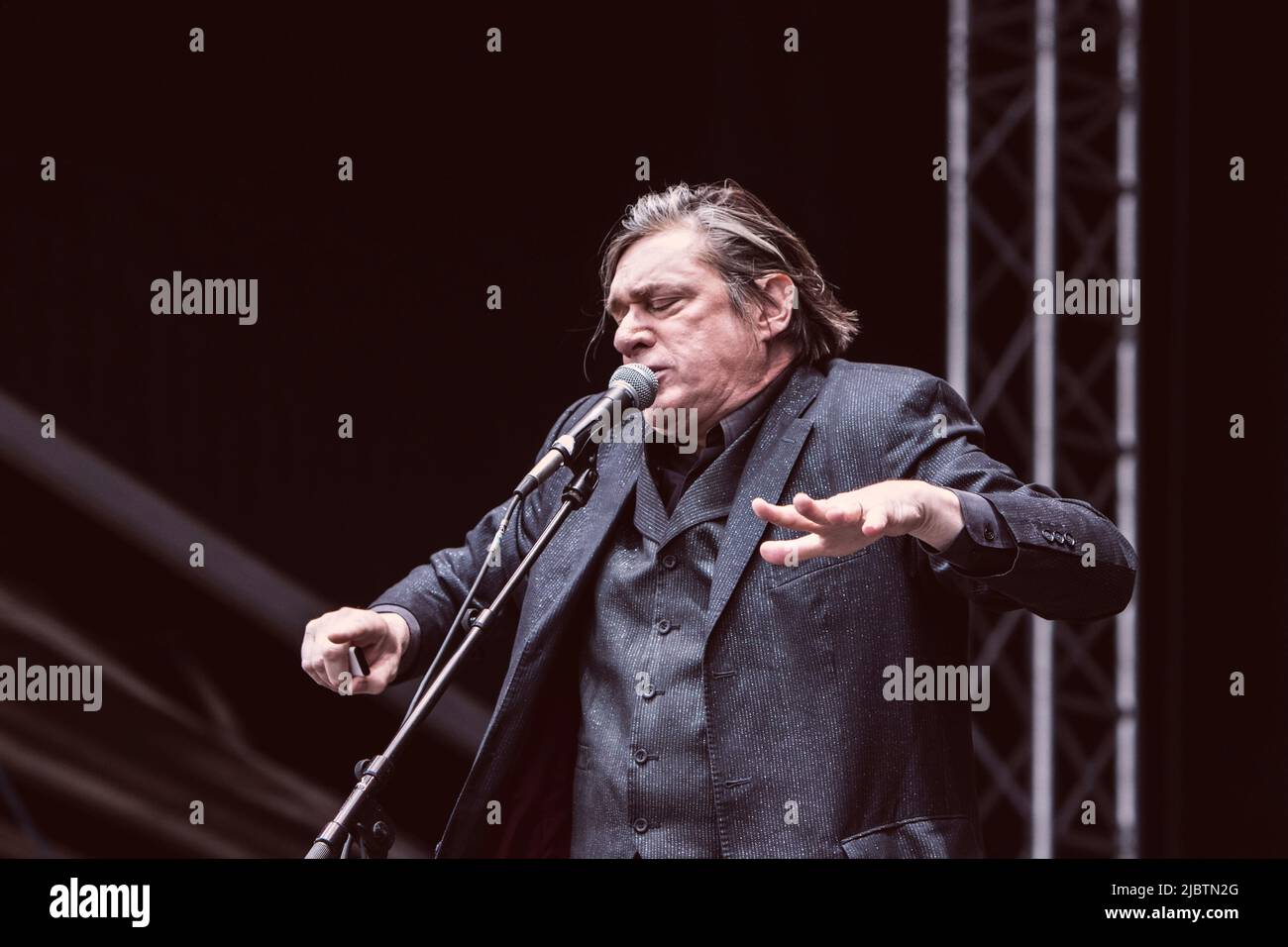 Blixa Bargeld of Einsturzende Neubauten performs on stage with his band ...