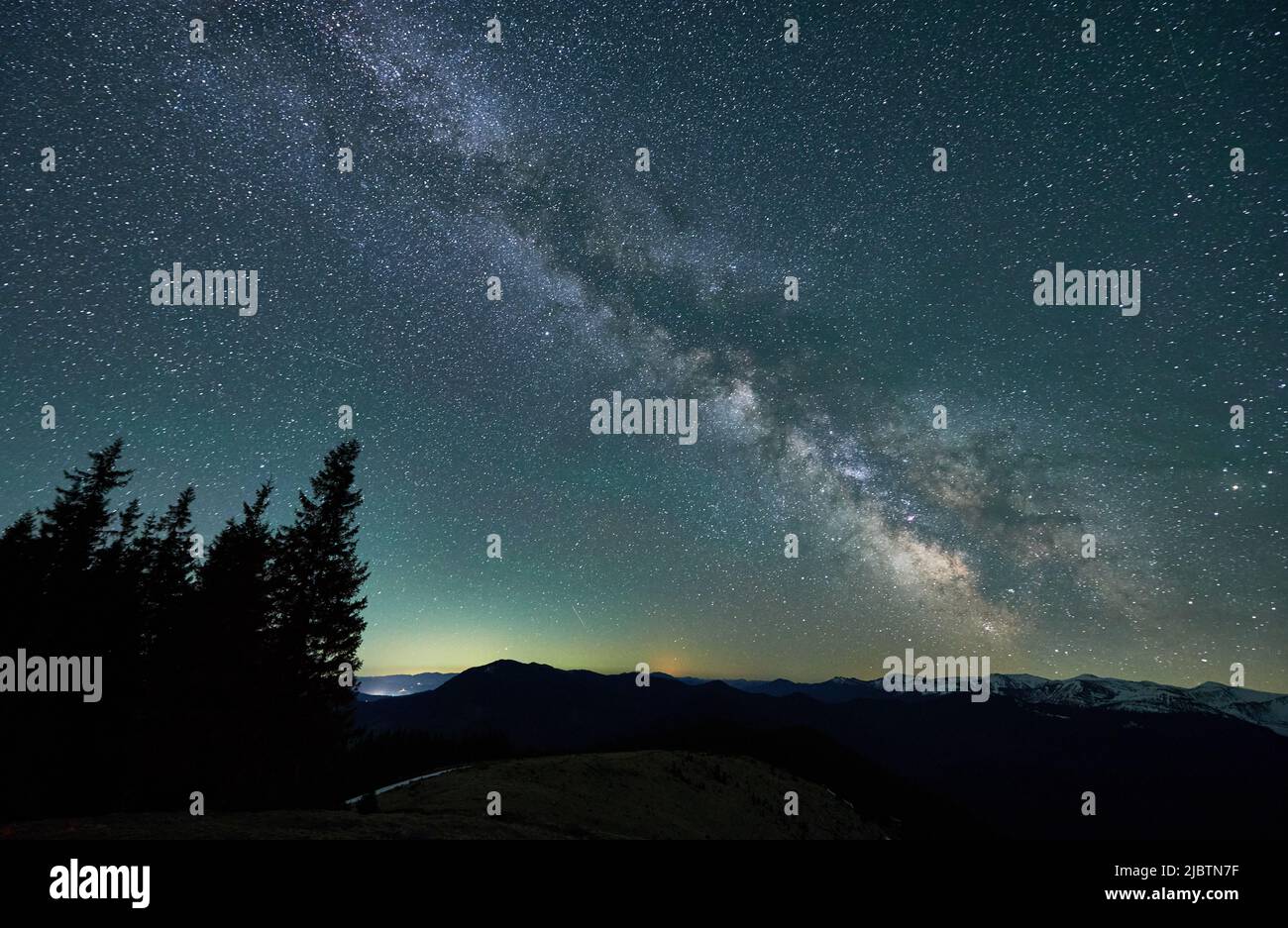 Magical starry night over mountain beskids. Silhouettes of trees, hills ...