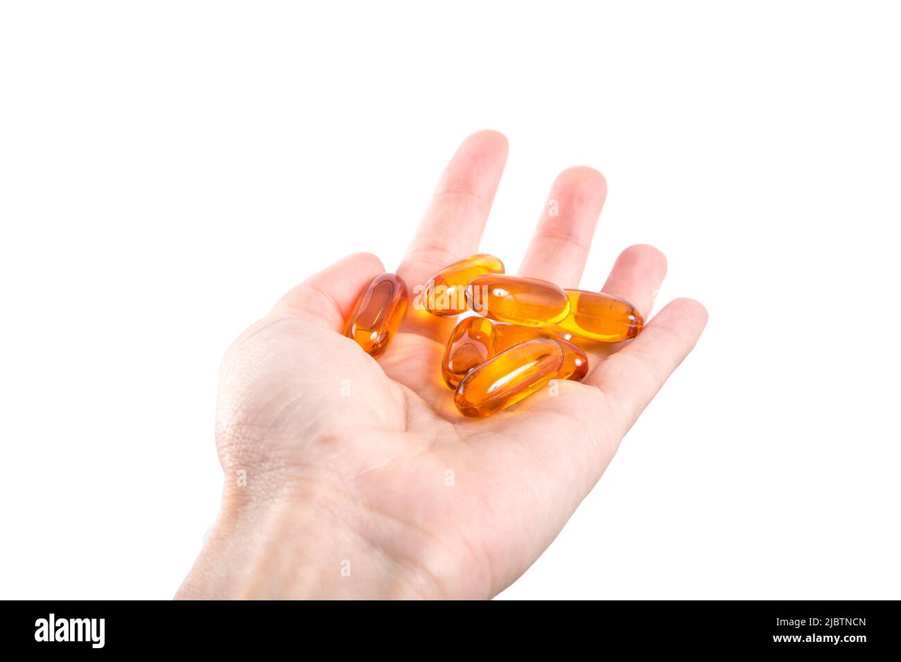 Hand full omega 3 capsules isolated on white Stock Photo - Alamy