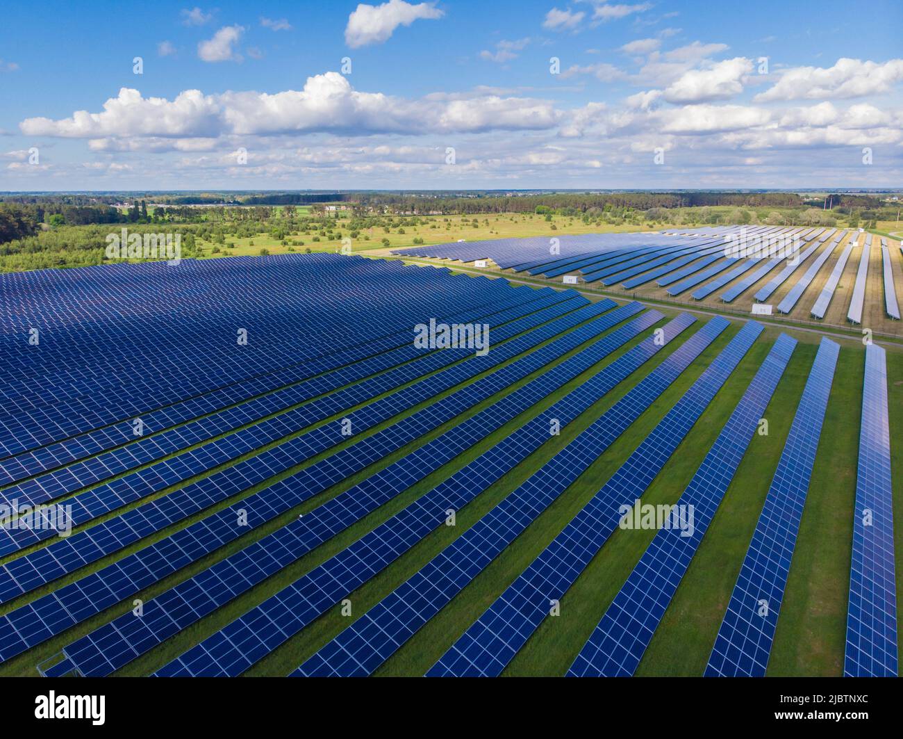 aerial view of solar panels on green lawn. drone shot, bird's eye Stock ...