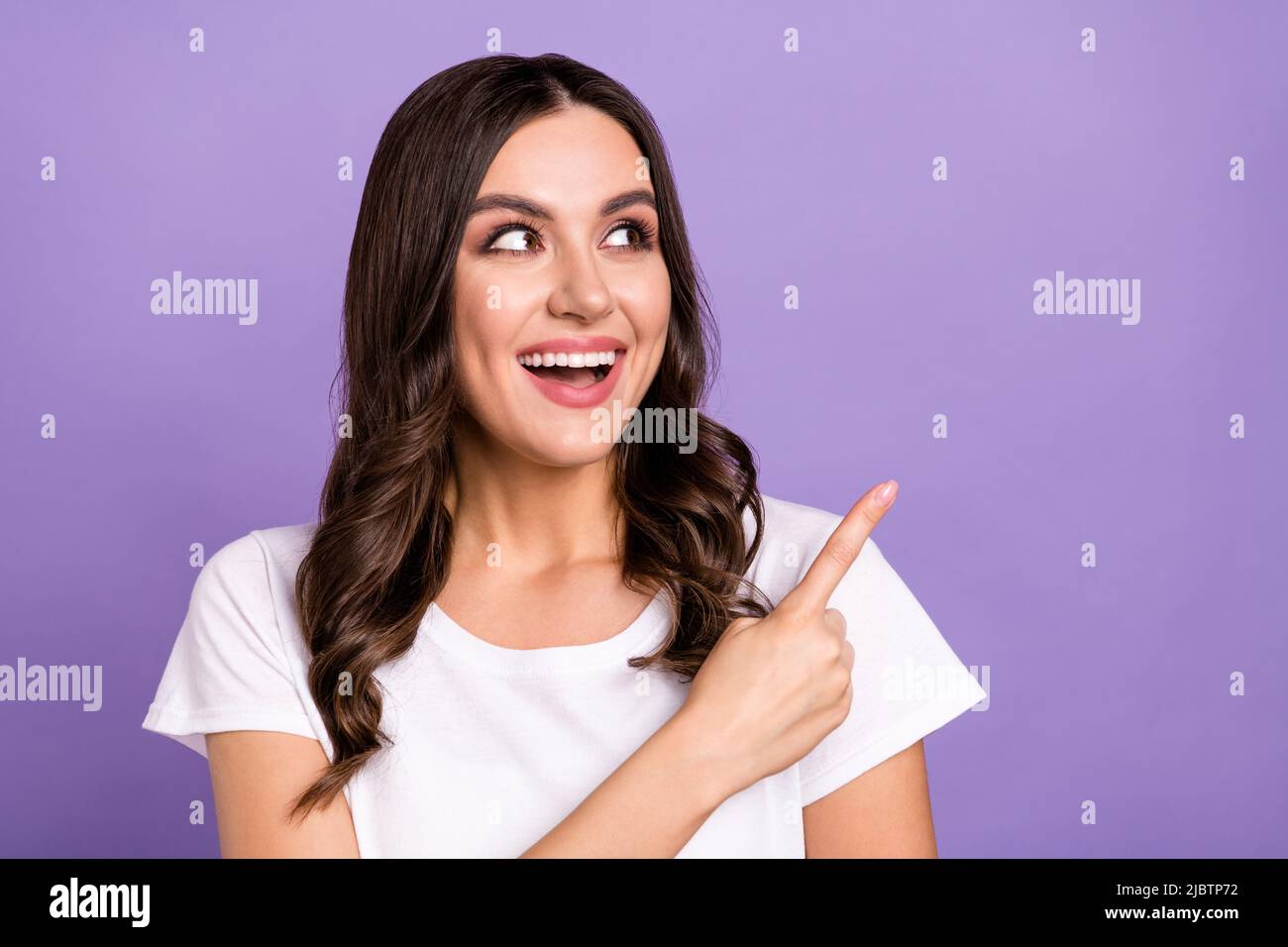Photo Of Impressed Brunette Millennial Lady Look Point Empty Space Wear