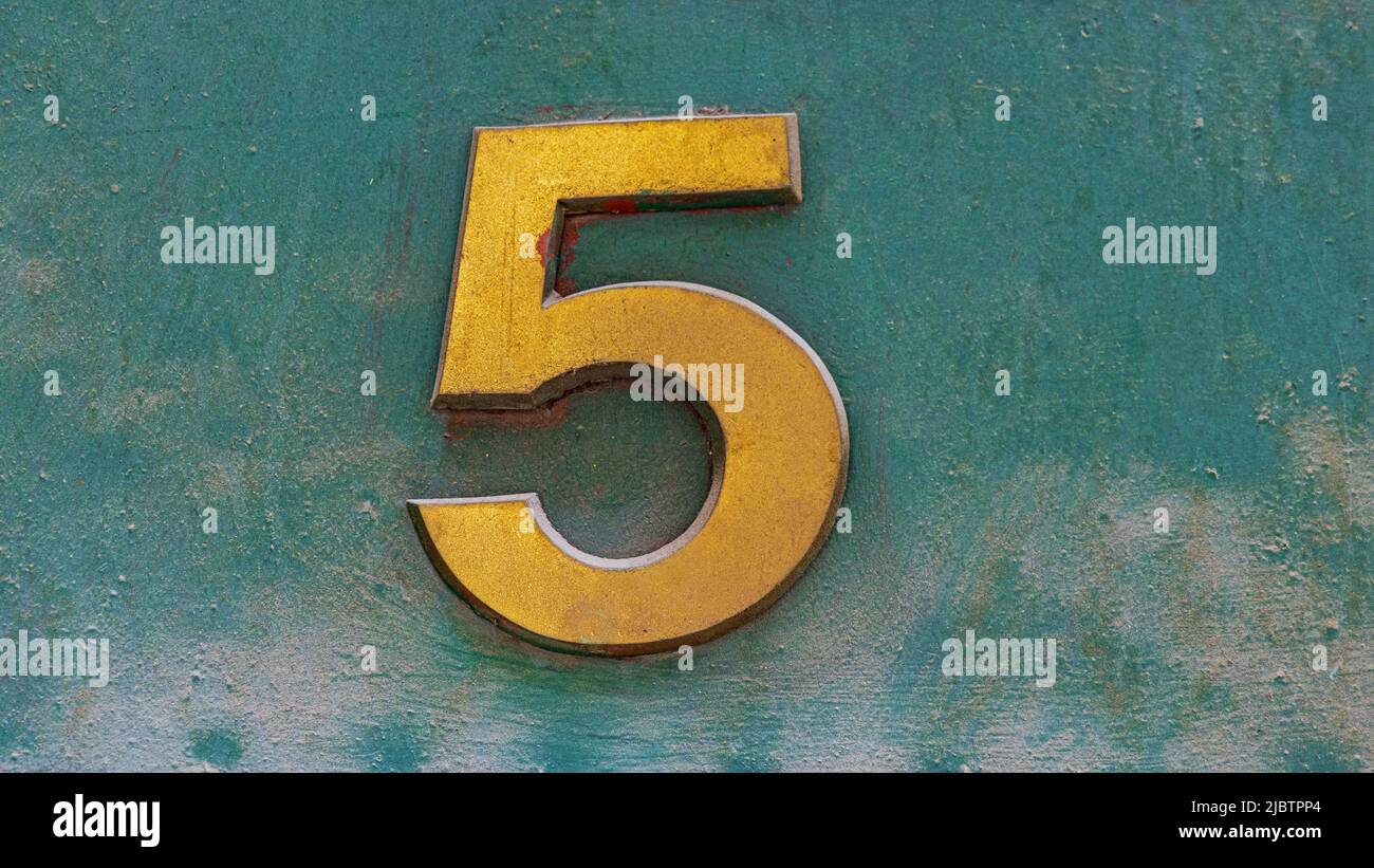 Gold Paint 3d Number Five Sign at Green Background Stock Photo - Alamy