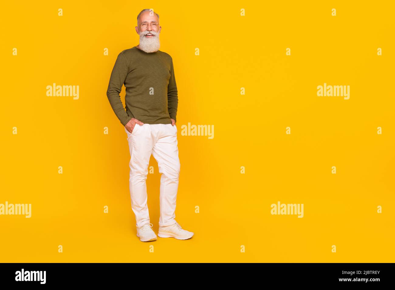 Photo of positive pensioner man posing hands pocket wear green shirt ...