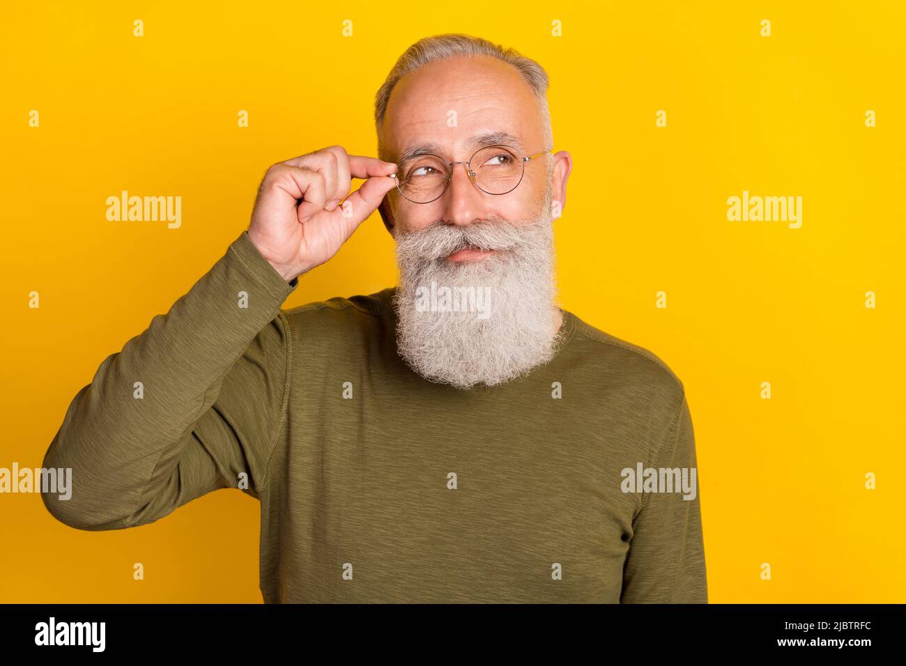 Photo of clever aged grey beard man touch eyewear look empty space wear ...