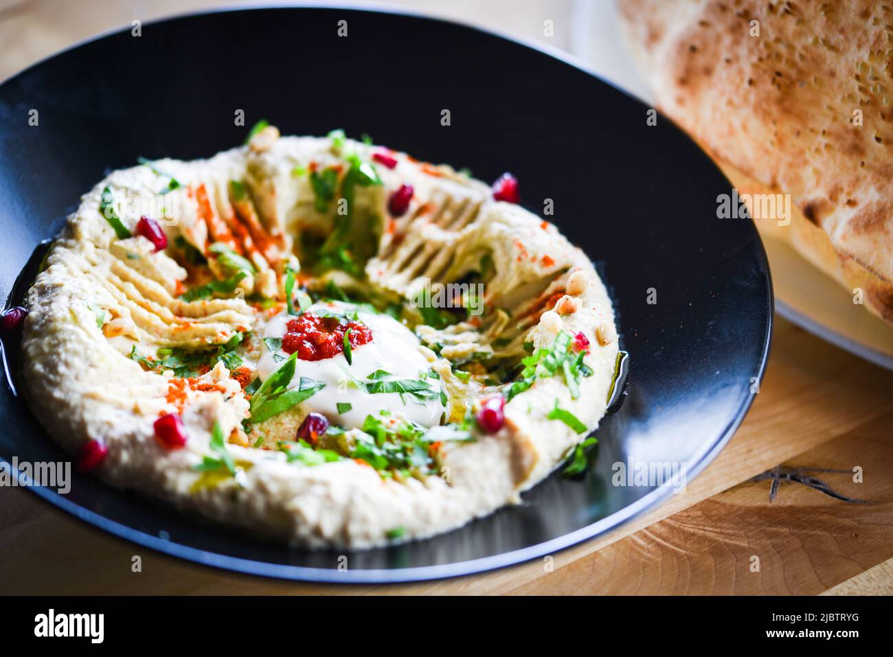delicious home made lebanese hummus with fresh pomegranate seeds Stock ...