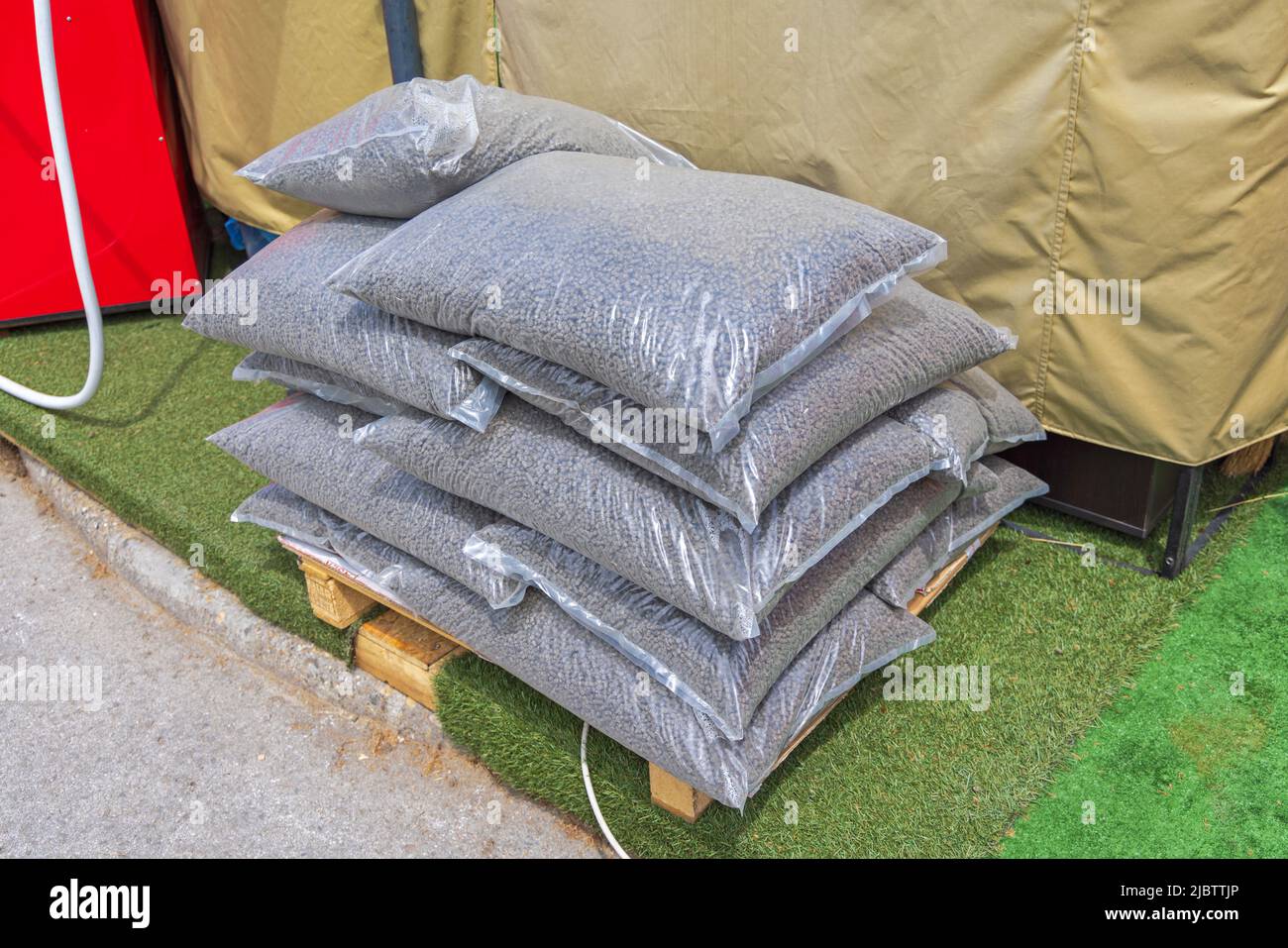 Pellet in Sacks at Pallet Ready for Winter Heating Stock Photo - Alamy