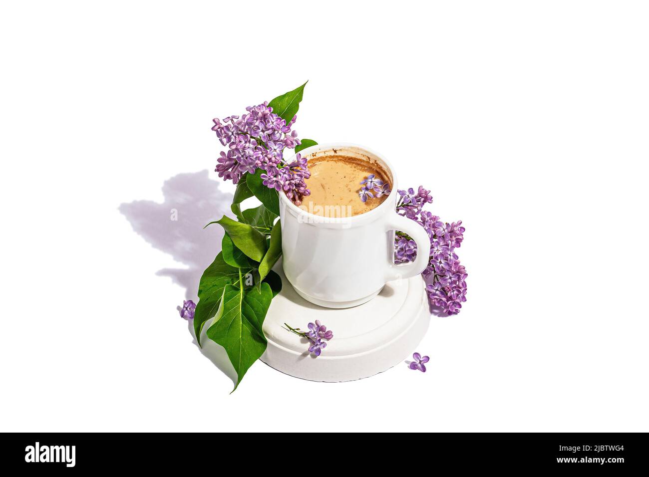Cup of coffee and lilac flowers bouquet isolated on a white background ...