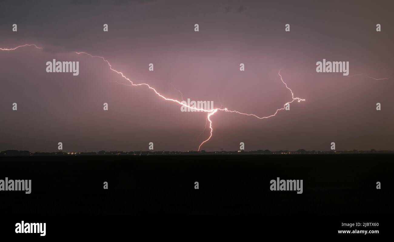 Powerful lightning strike at night in heavy rain Stock Photo - Alamy